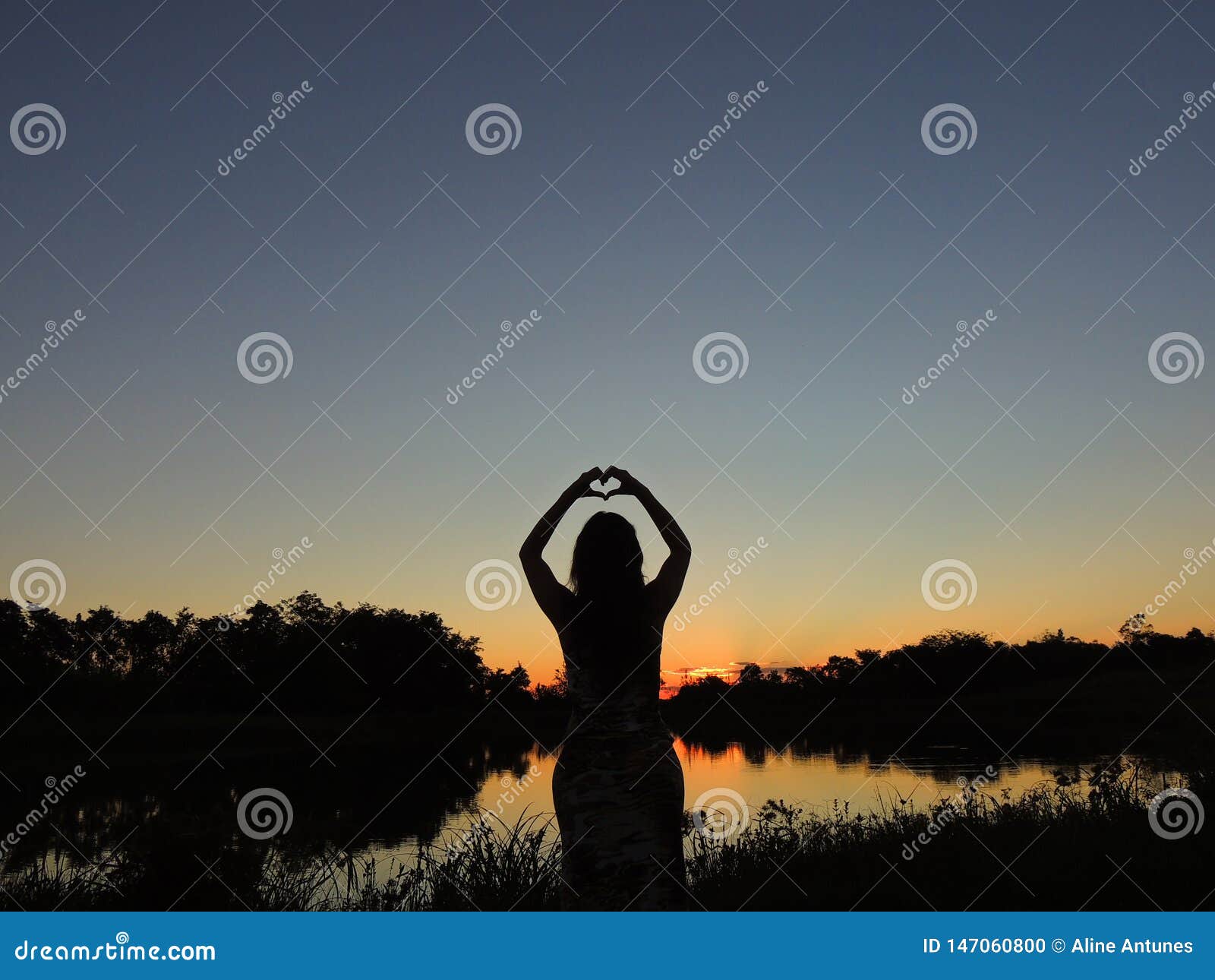 Woman Making Heart with Hands Over Head Stock Photo - Image of fazendo ...