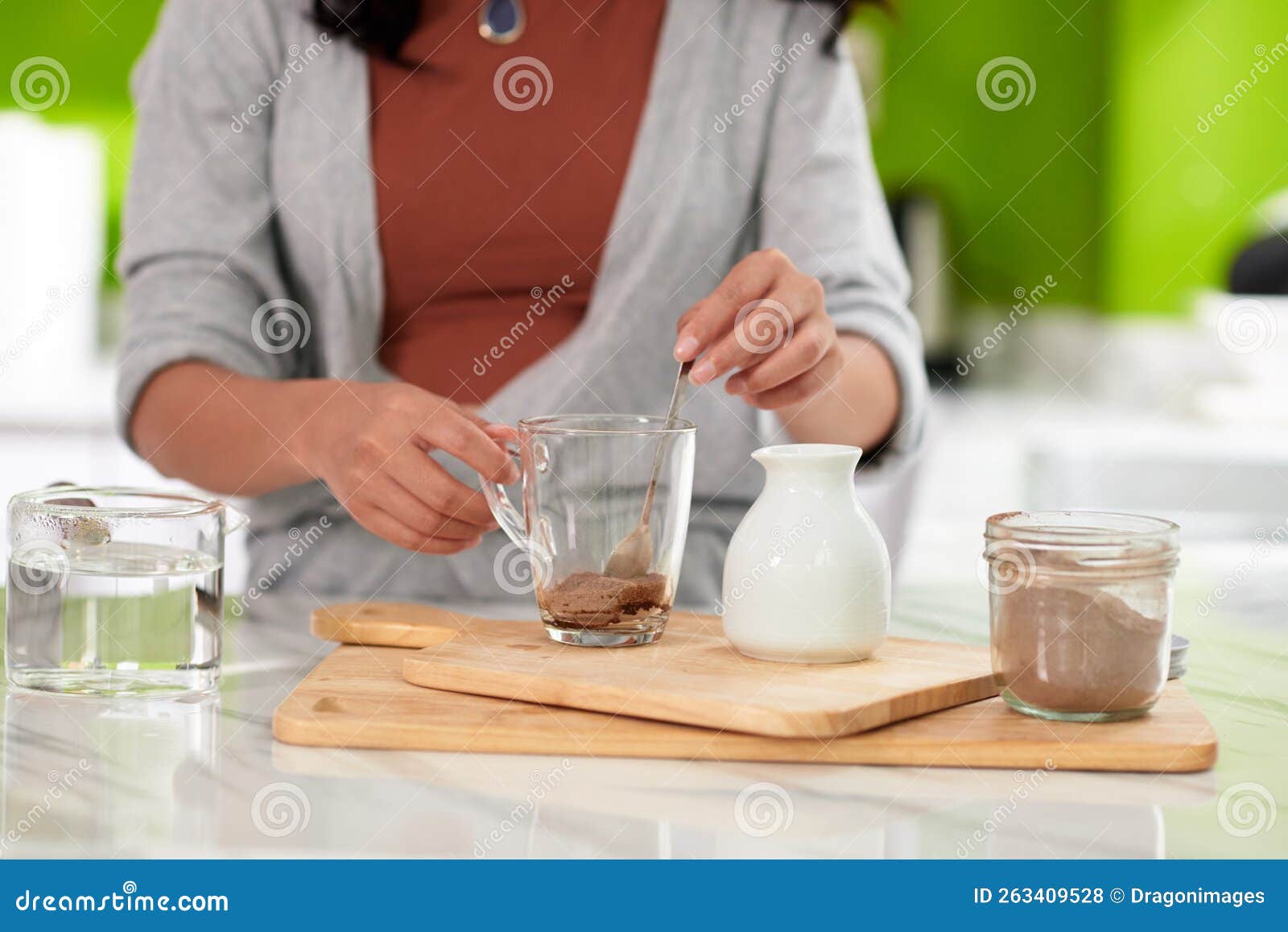 Woman Making Hot Chocolate stock photo. Image of process - 263409528
