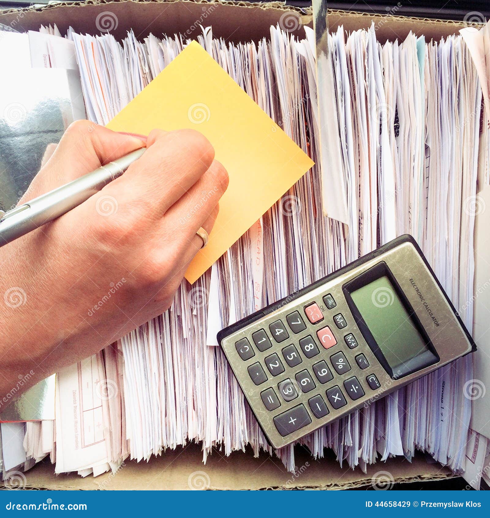 Woman making a note editorial stock image. Image of calculator - 44658429