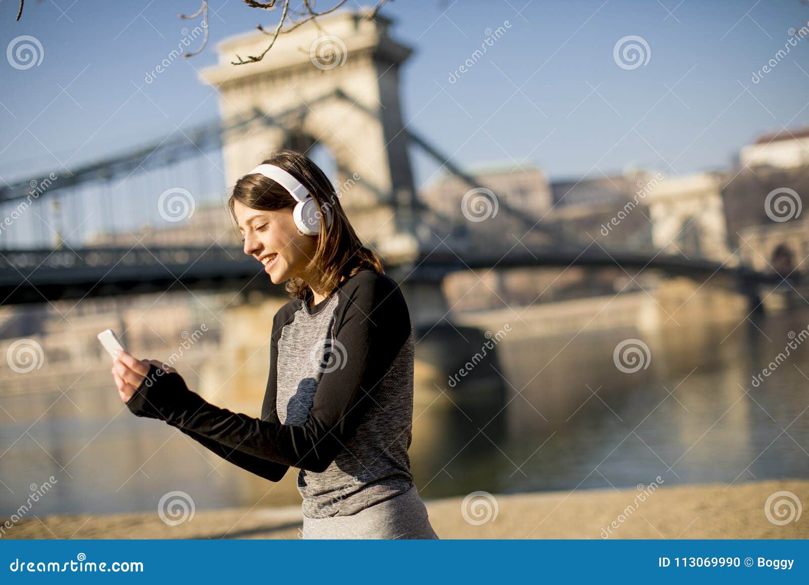 Woman Making a Pause after the Exercise and Using Mobile Phone Stock ...