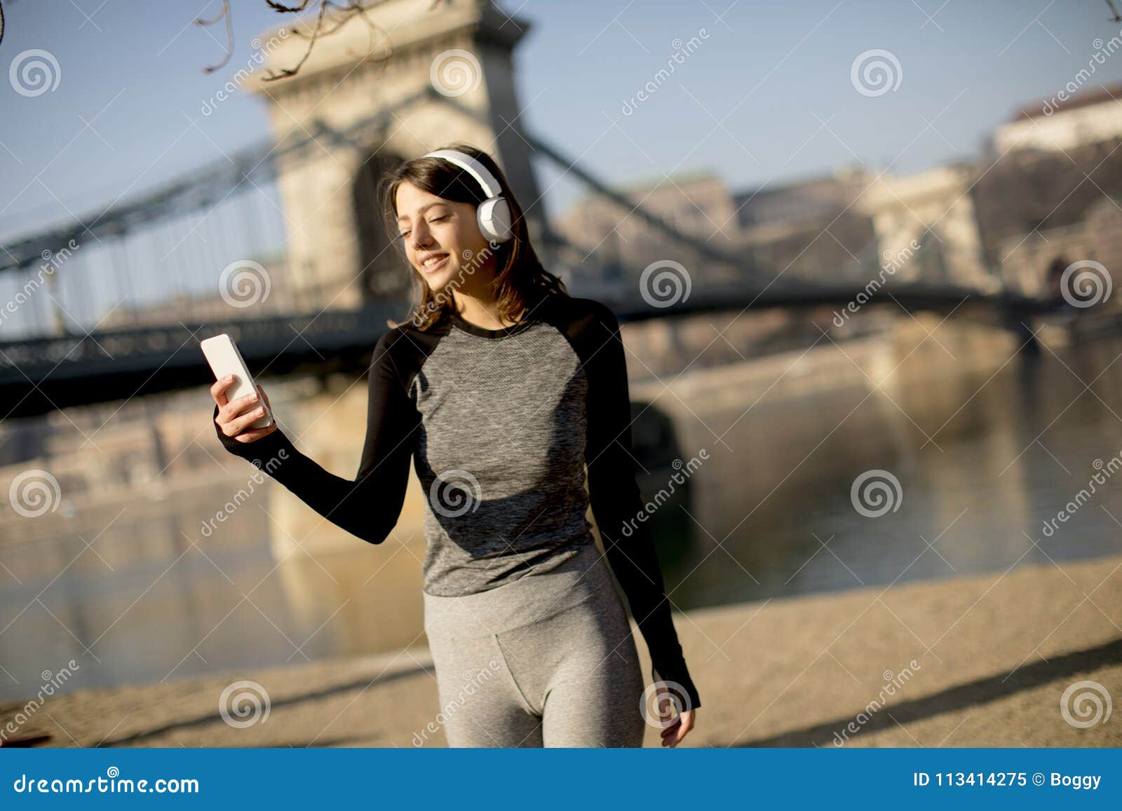 Woman Making a Pause after the Exercise and Using Mobile Phone Stock ...