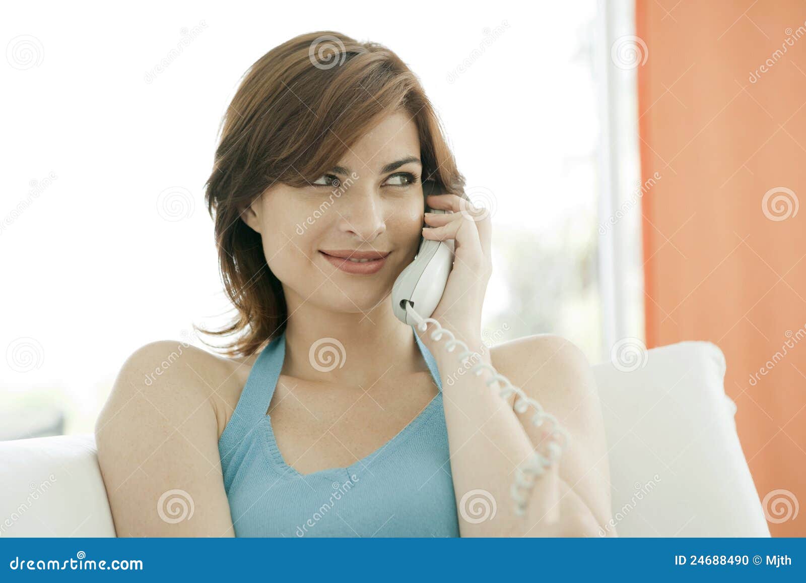 Woman Making a Phone Call and Smiling Stock Photo - Image of house ...