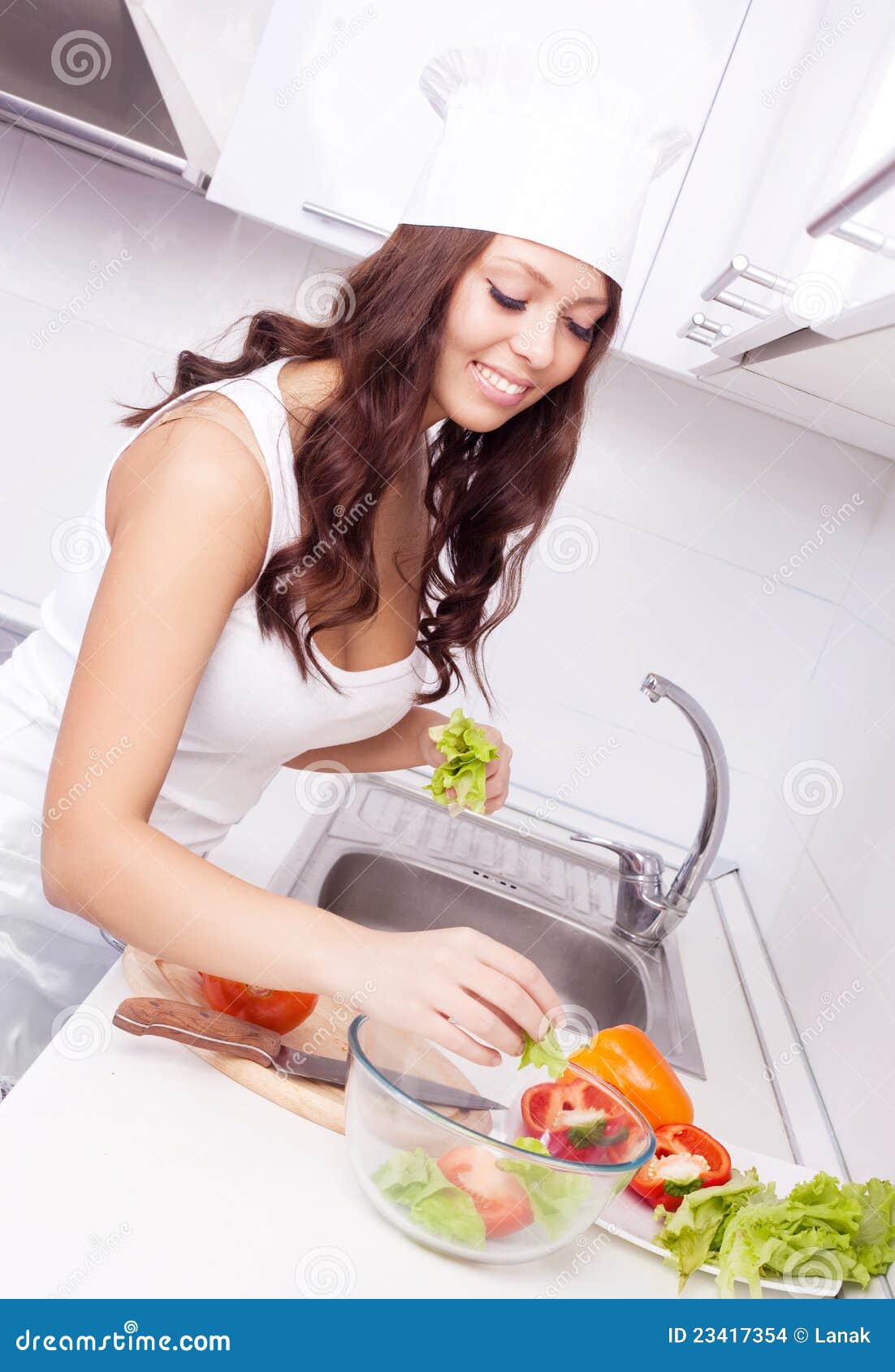 Woman making salad stock photo. Image of healthy, knife - 23417354