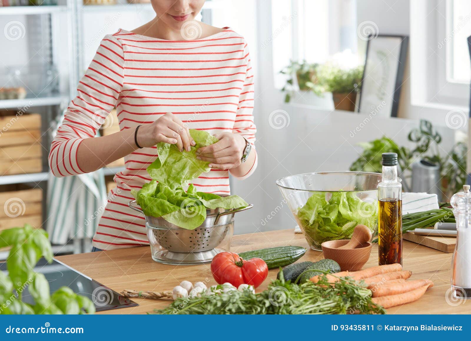 Woman making a salad stock image. Image of kitchen, slow - 93435811