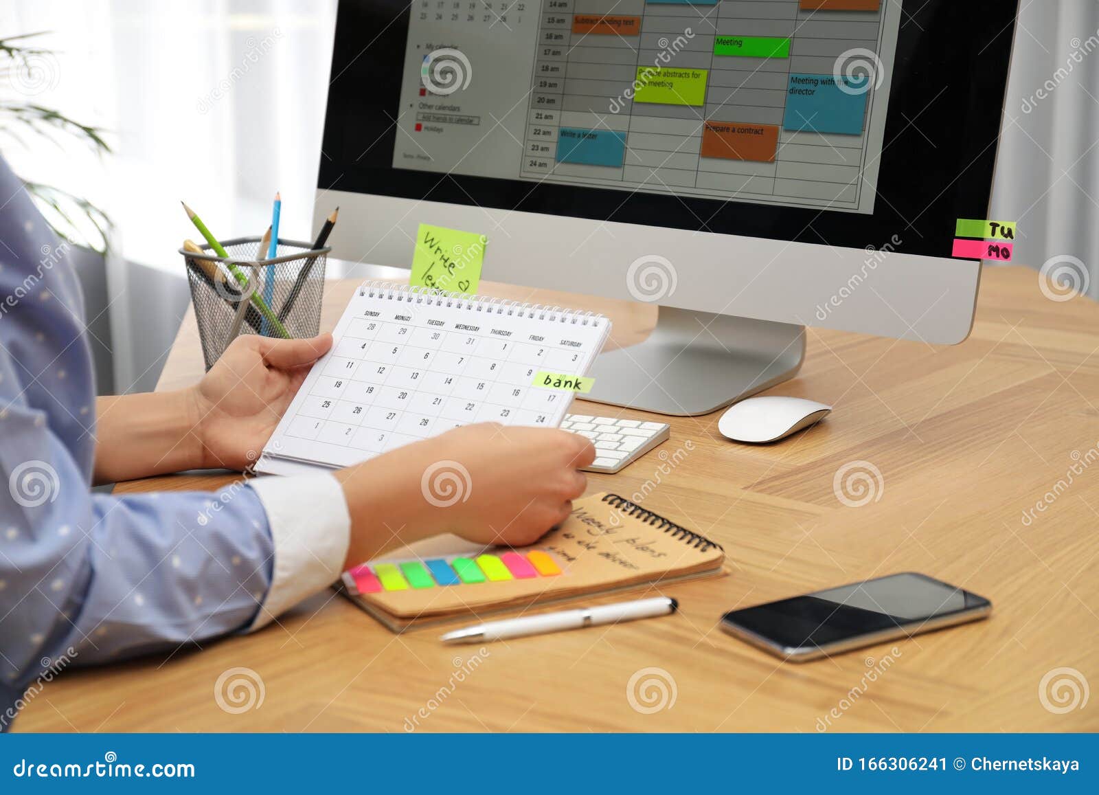Woman Making Schedule Using Calendar at Table in Office Stock Image ...