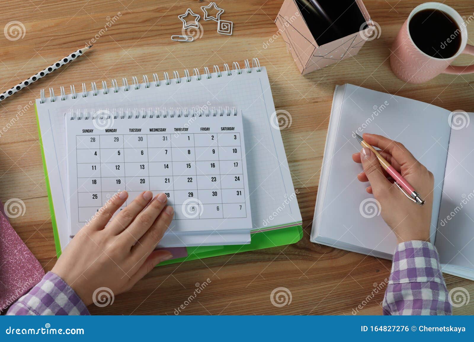 Woman Making Schedule Using Calendar at Table, Top View Stock Photo ...