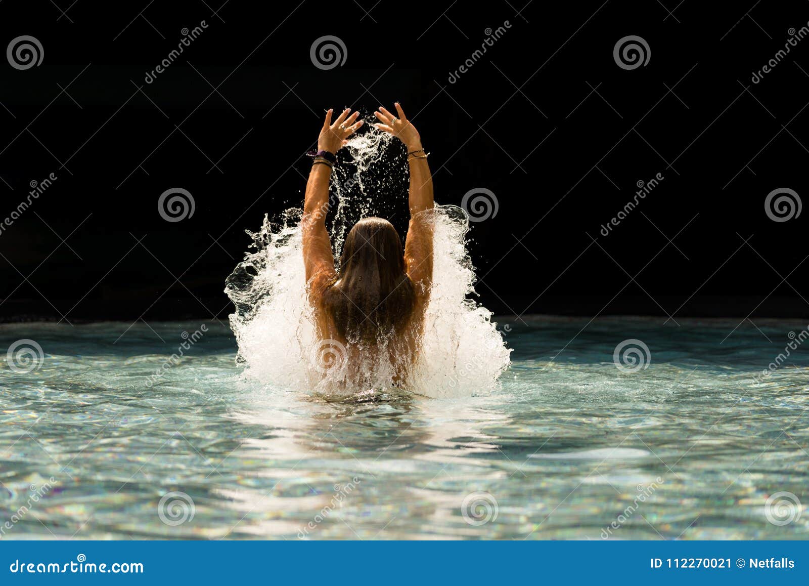 Young Beautiful Woman Making Water Splash at the Pool Stock Image ...