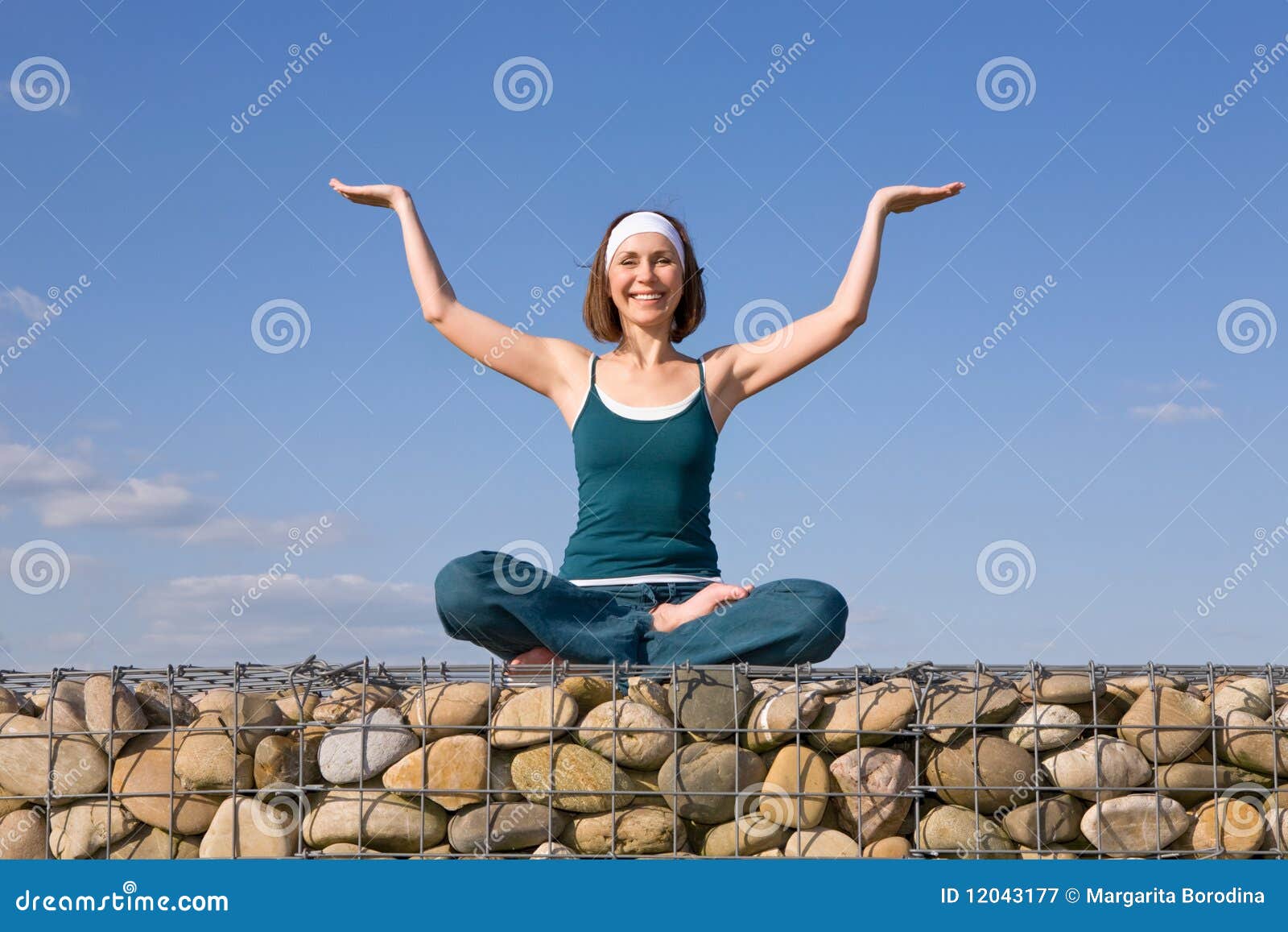 Woman Making Yoga Exercises in Top of a Stone Wall Stock Image - Image ...