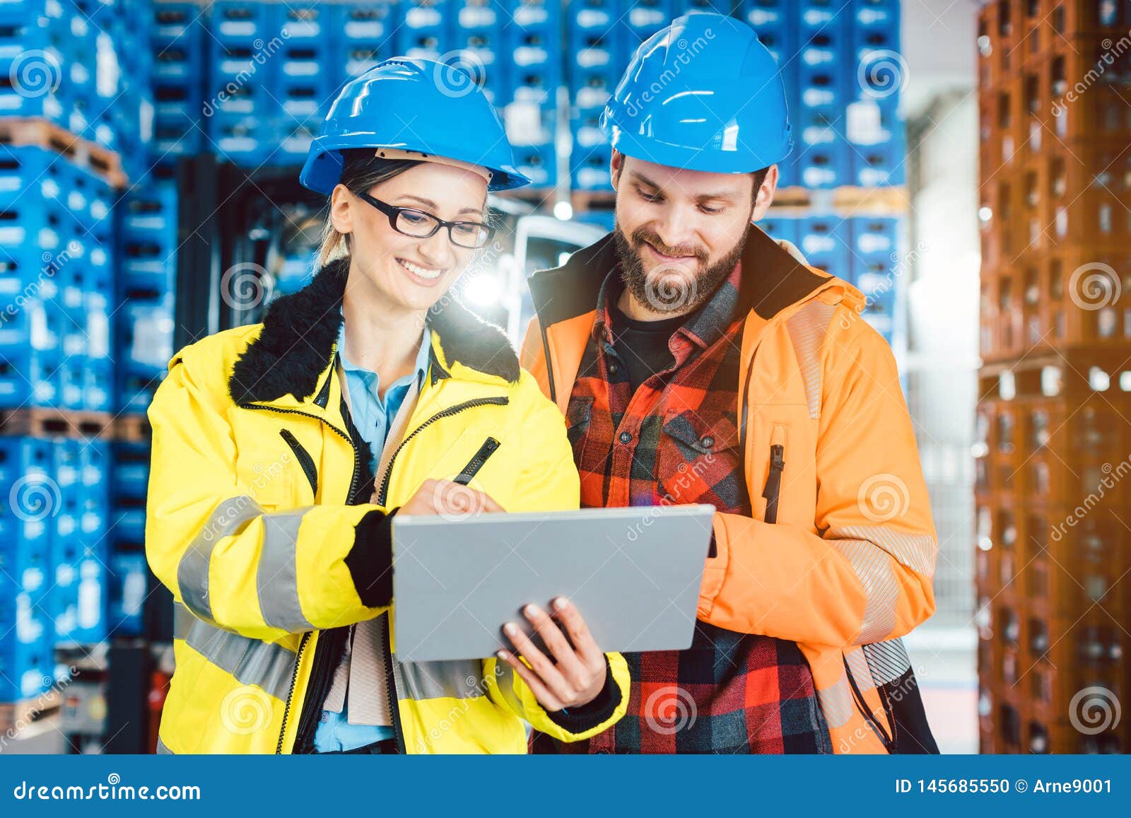 Woman and Man As Workers in Logistics Center Using Computer Stock Photo ...