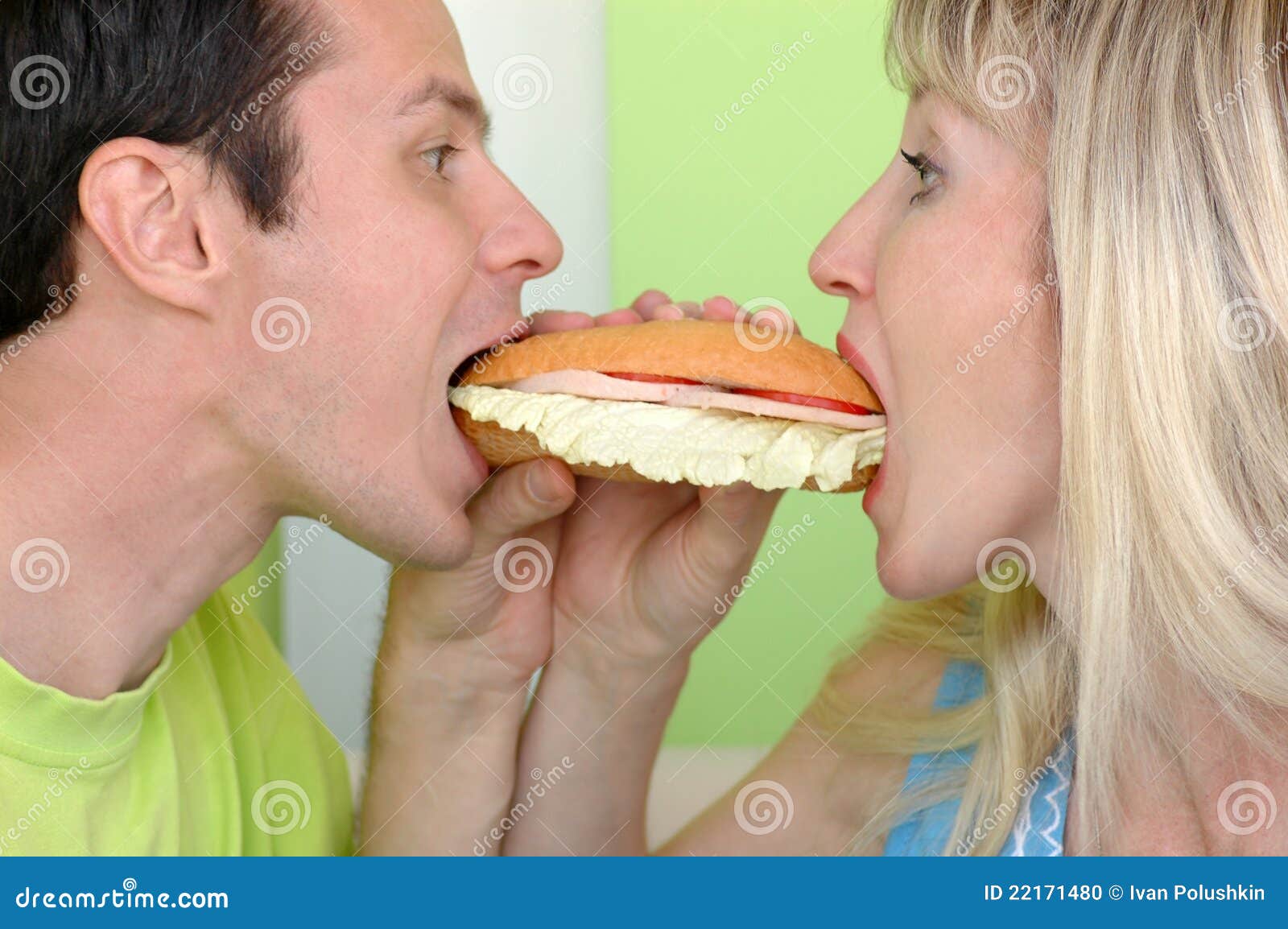 Woman and Man Bite a Sandwich Stock Photo - Image of humen, hair: 22171480