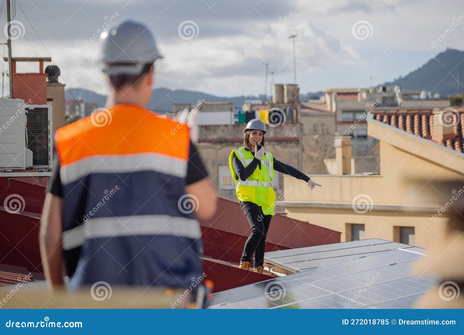 Woman and Man Engineer Communicating during Maintenance of Solar Panel ...