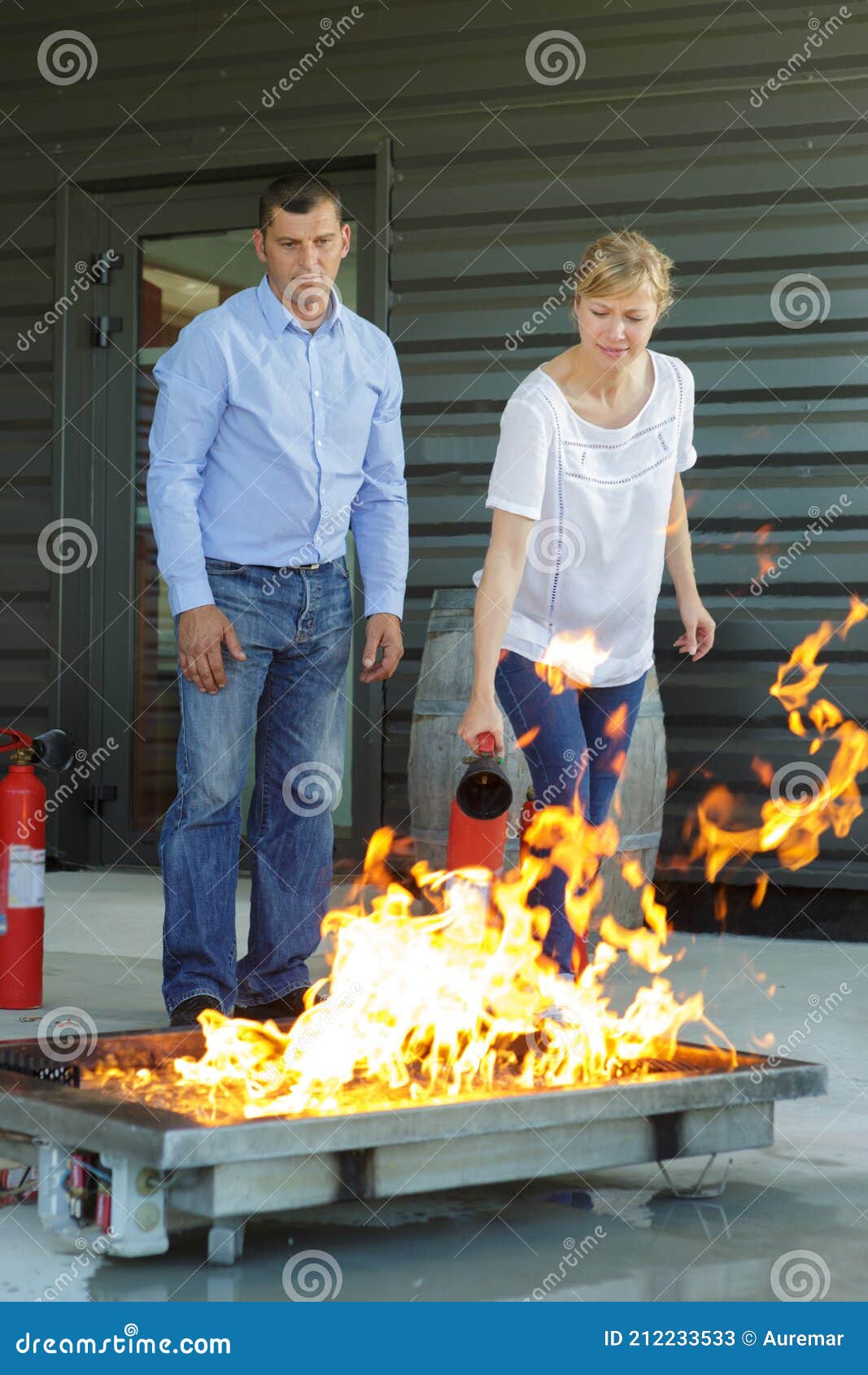 Woman and Man on Firefighting Drill Stock Image - Image of protective ...