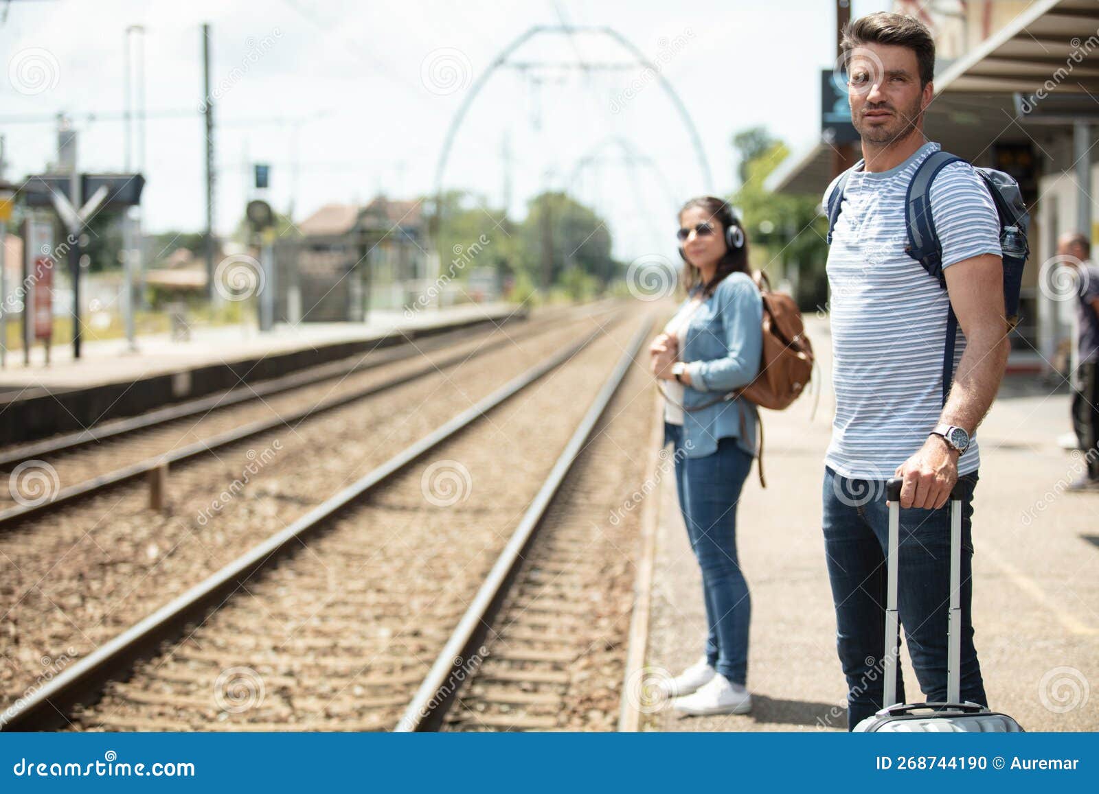 Woman and Man Waiting for Train on Platform Stock Photo - Image of ...