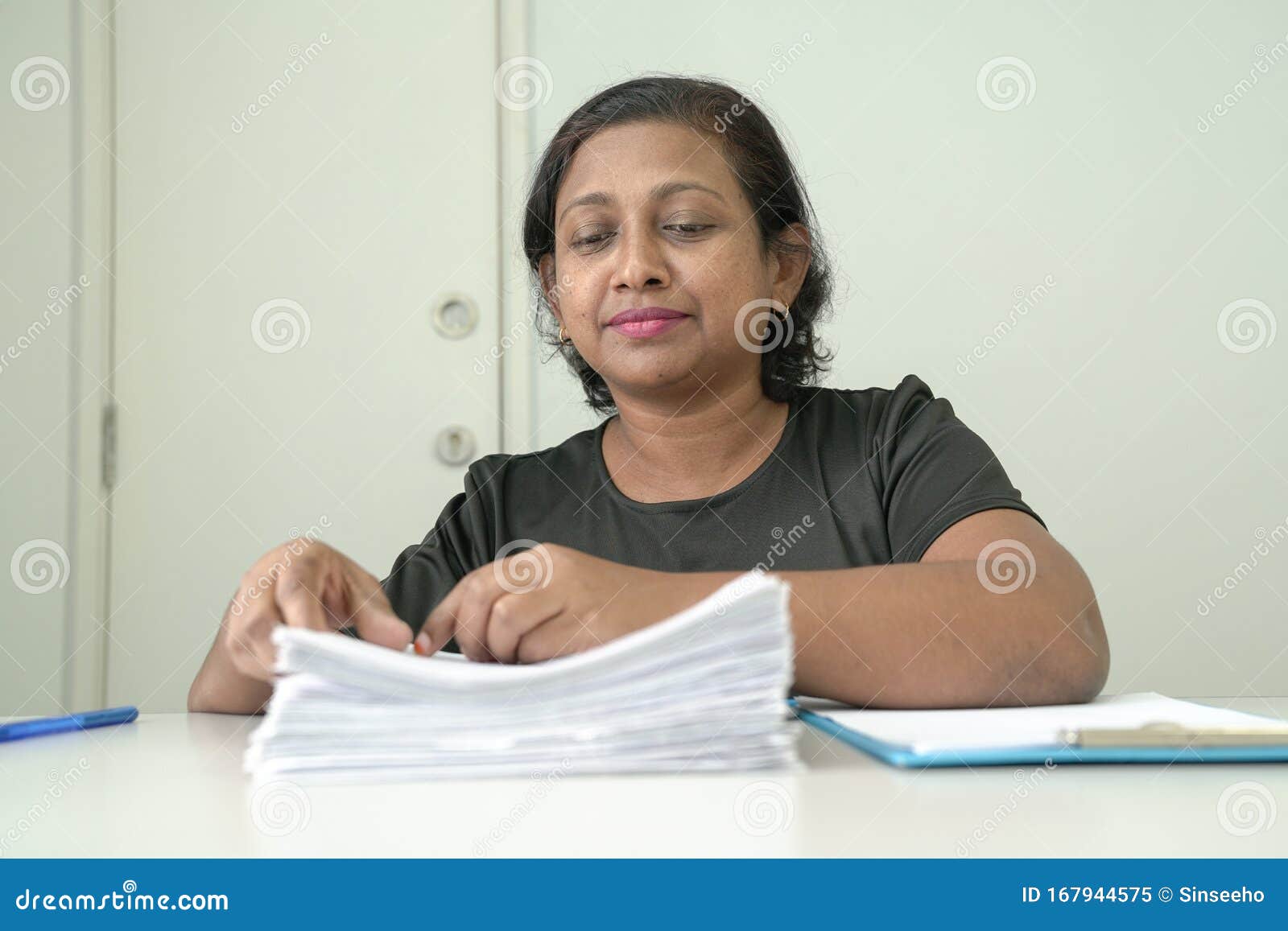 Woman Manager or Executive Going through Documents in File Stock Image ...