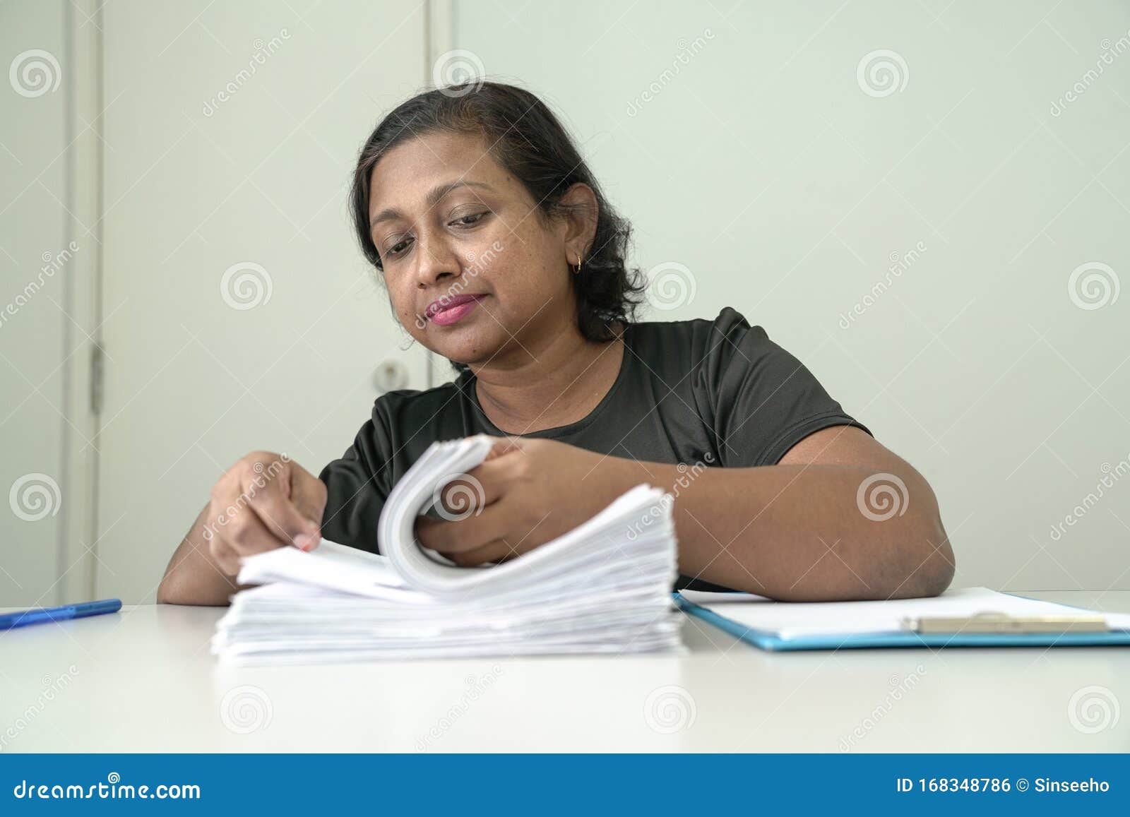 Woman Manager or Executive Going through Documents in File Stock Photo ...