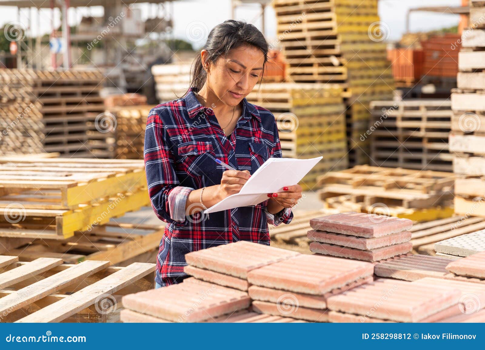 Woman Manager Leads the Accounting of Materials at Construction Site ...