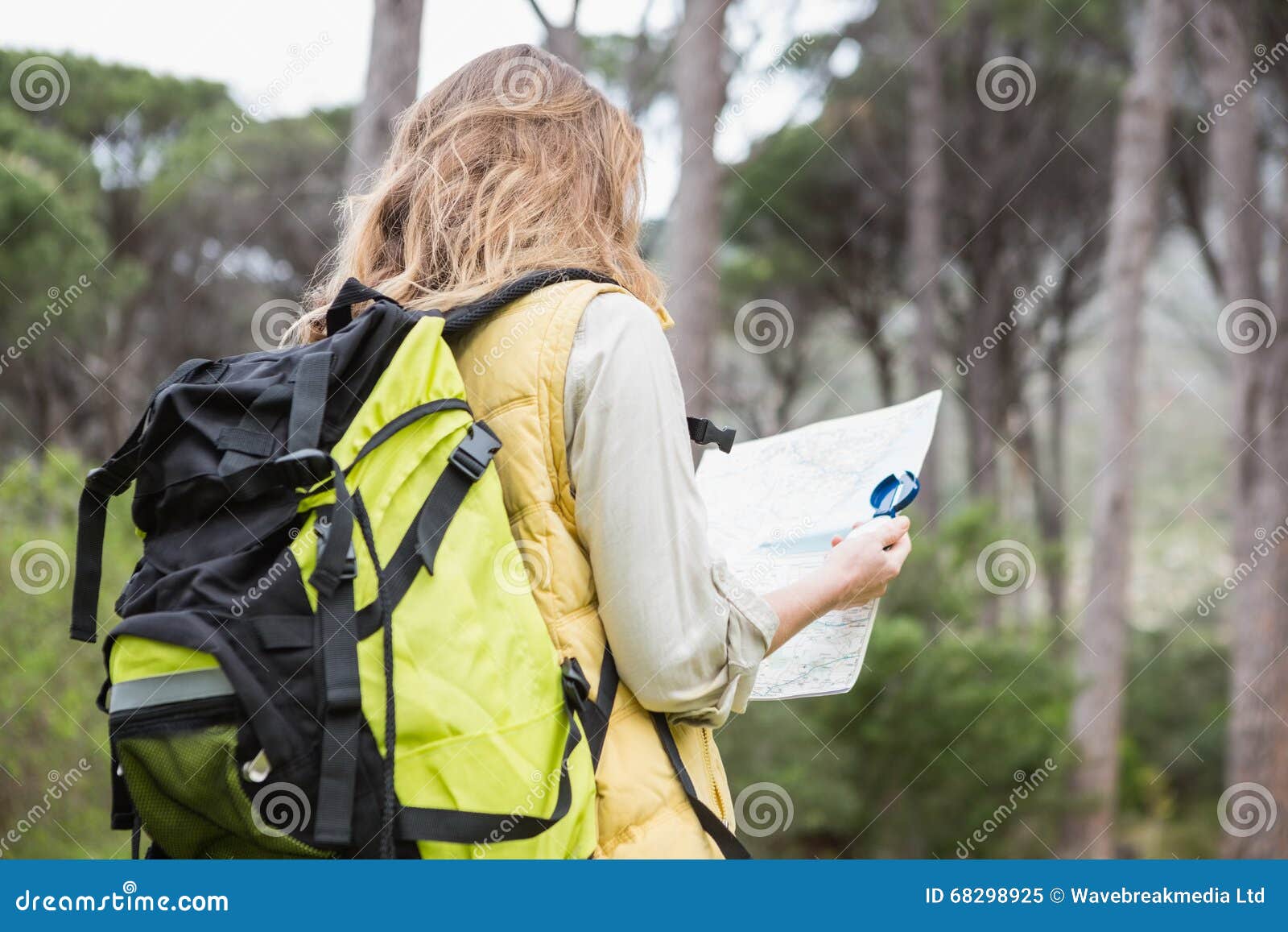 Woman with map and compass stock image. Image of outdoorsy - 68298925