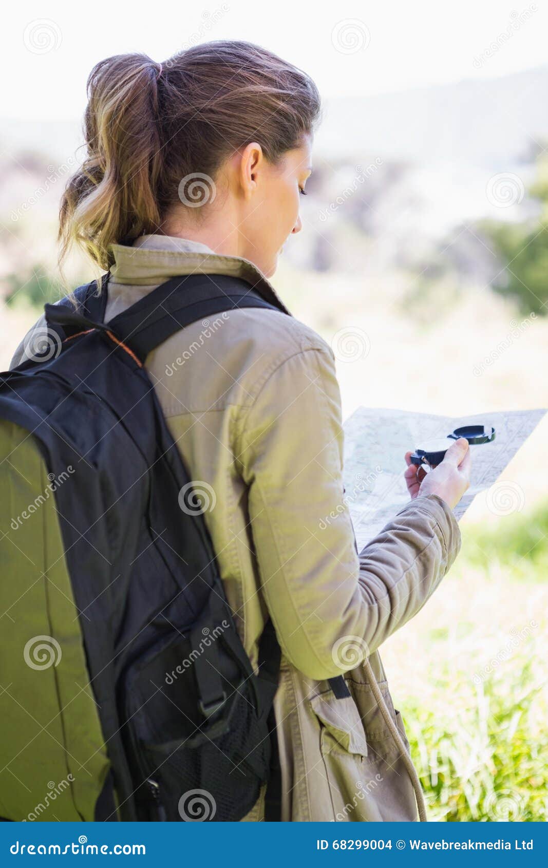 Woman with map and compass stock photo. Image of exploration - 68299004