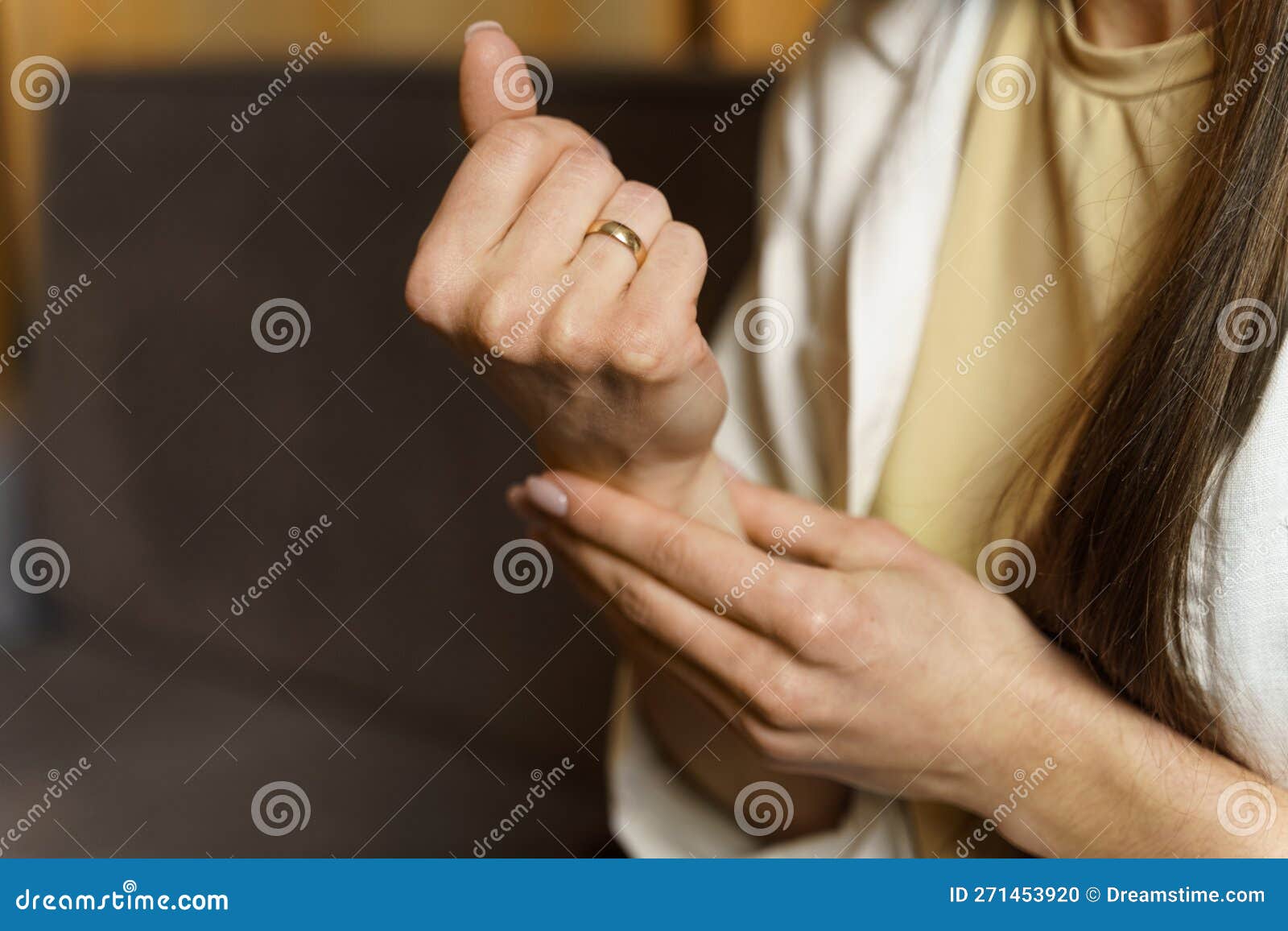 A Woman Measures Her Pulse with Her Fingers on Her Arm Stock Photo ...