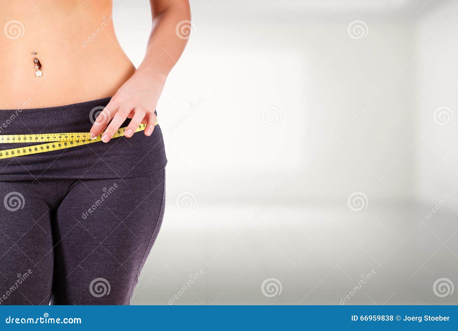 Woman measuring her hip stock photo. Image of measuring - 66959838