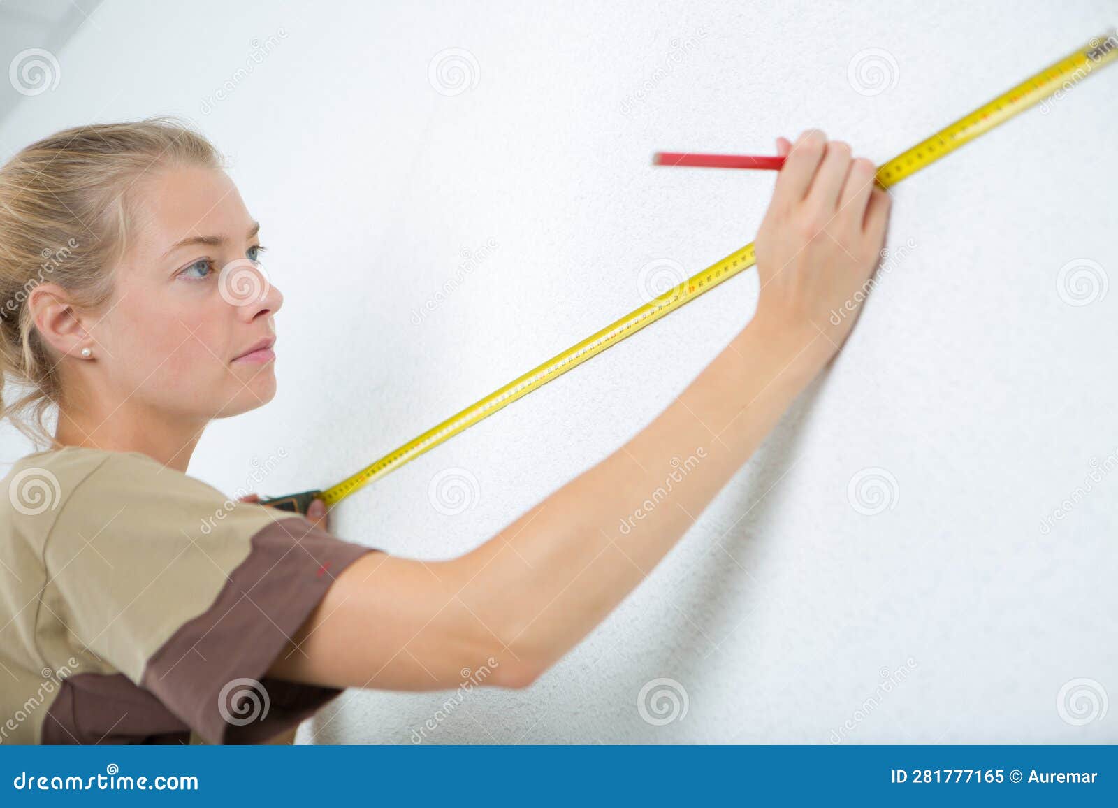 Woman measuring wall stock image. Image of builder, laborer - 281777165