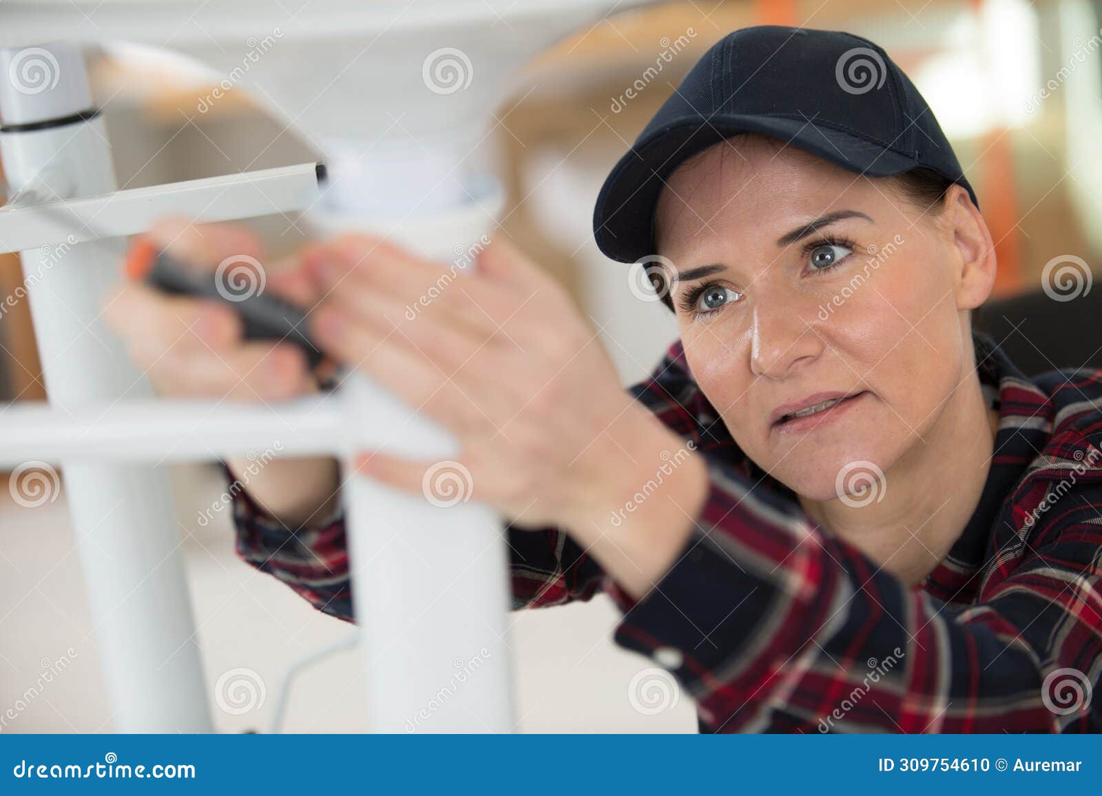 Woman Mechanic Fixing Chair Stock Photo - Image of profession, fixing ...