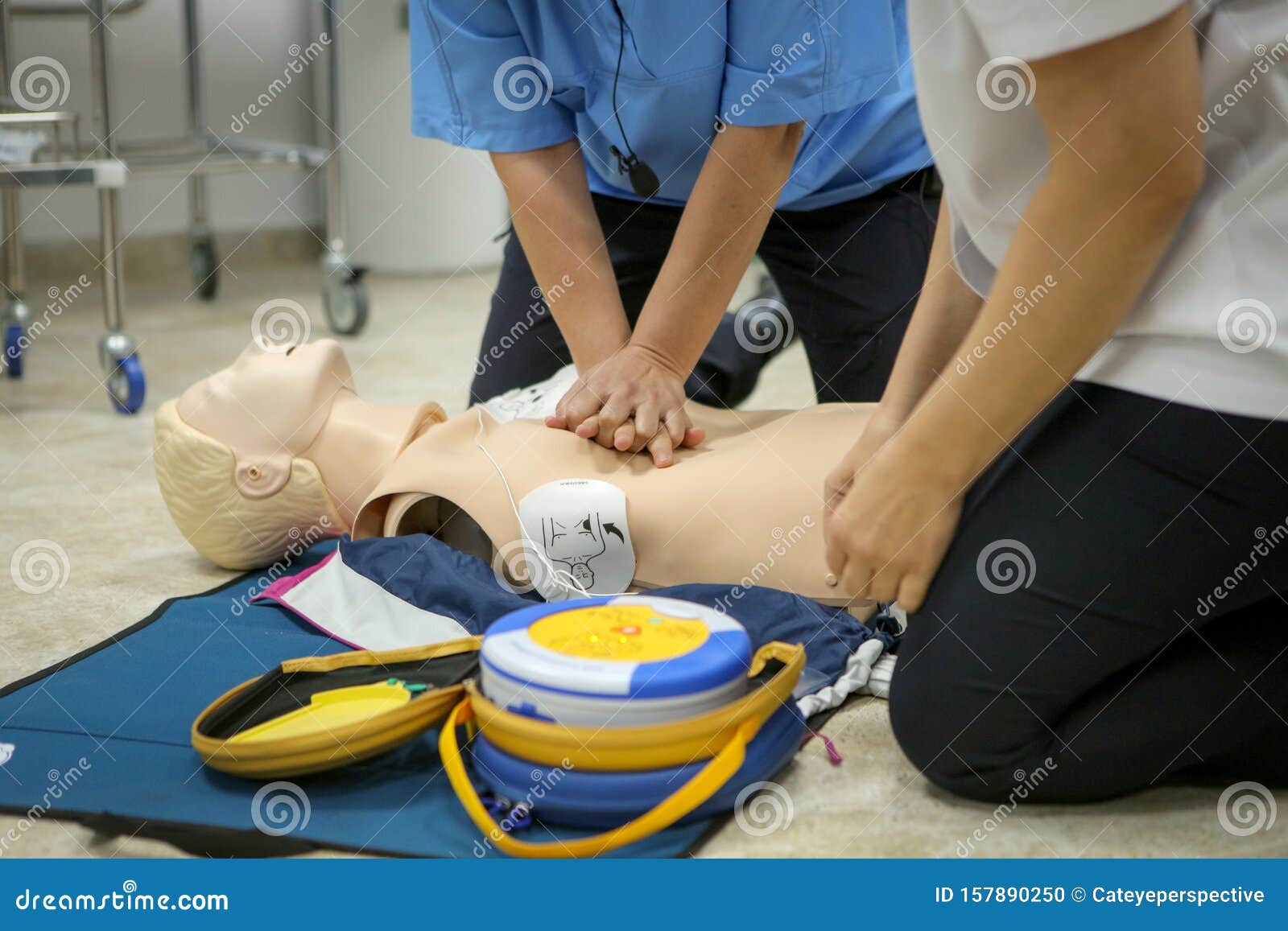 Woman Medic Demonstrates CPR Methods on a Plastic Mannequin Stock Photo ...
