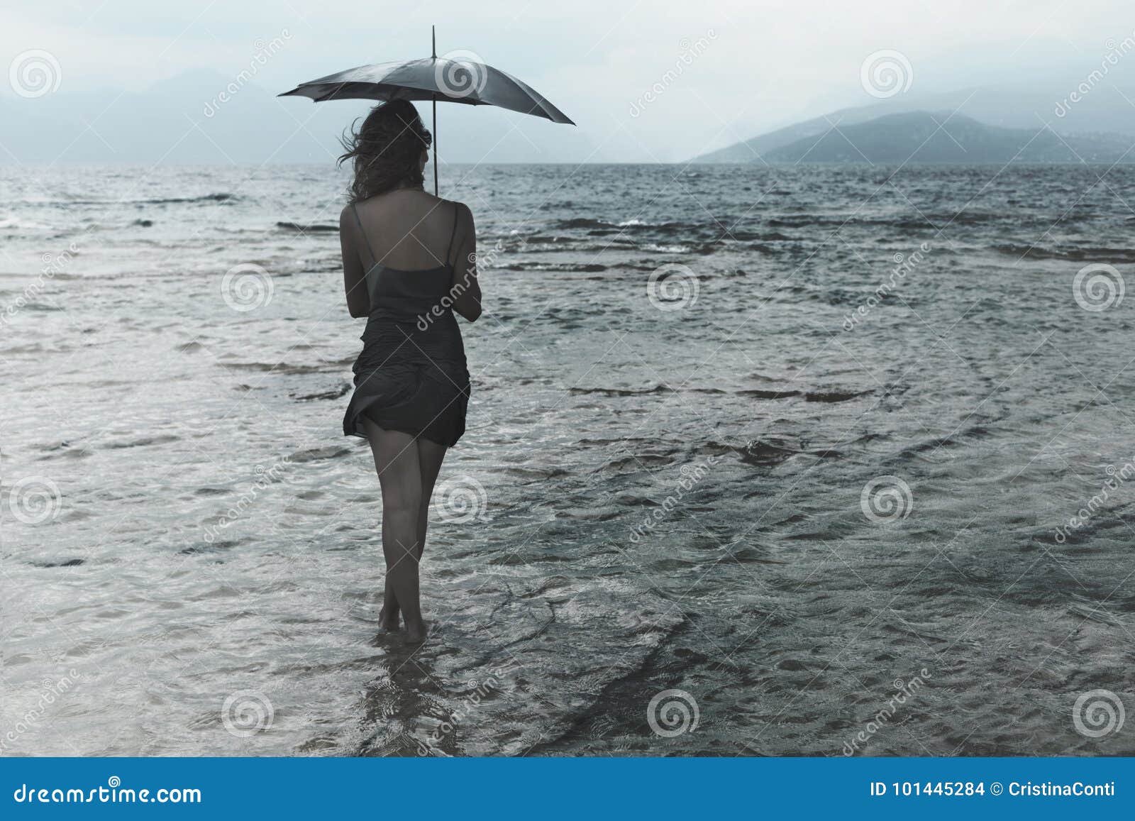 Woman Meditating Looking at Infinity in the Rain and Thunderstorm Stock ...