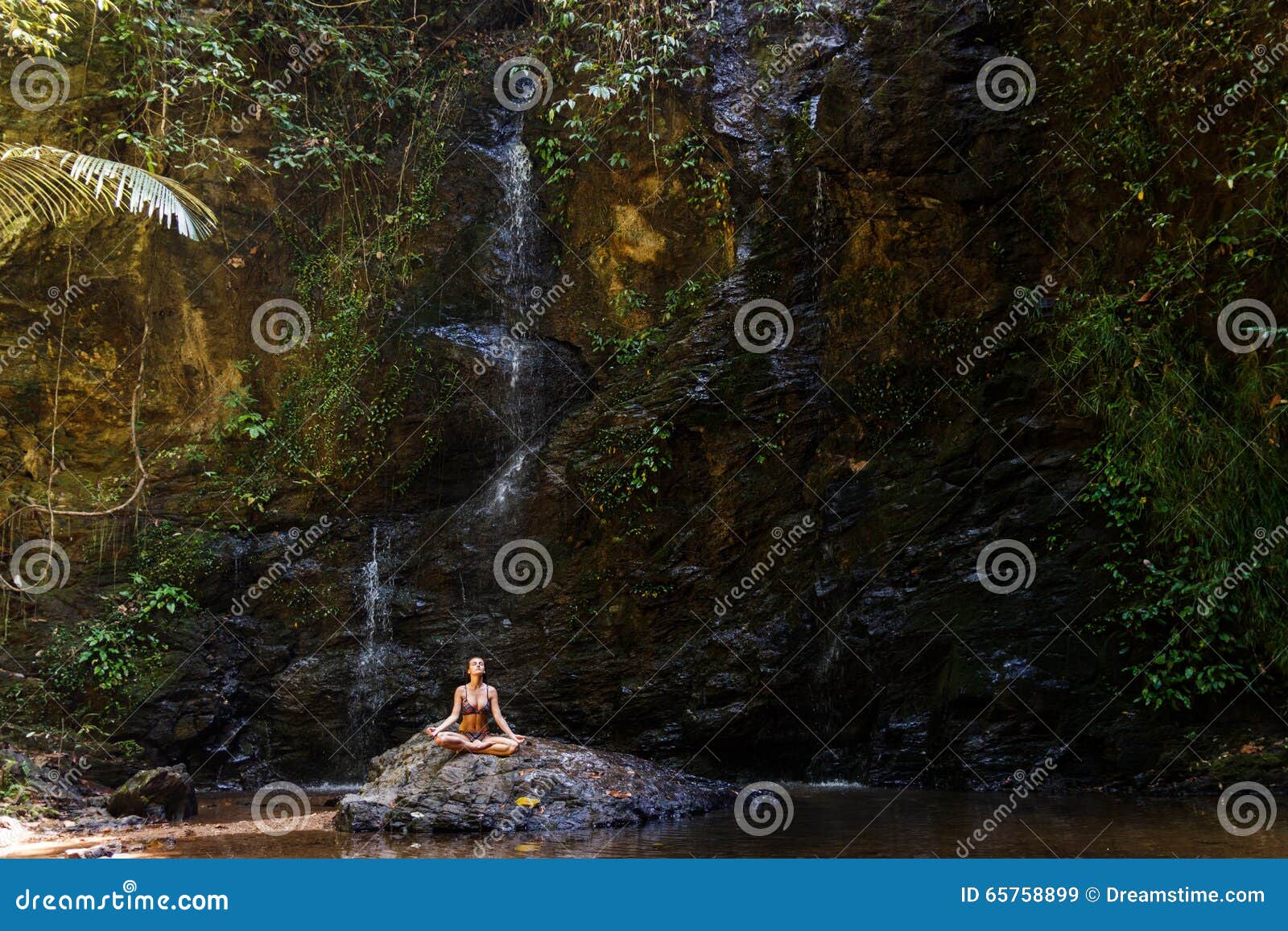 Woman Meditating in Nature Waterfall on the Rock Stock Image - Image of ...