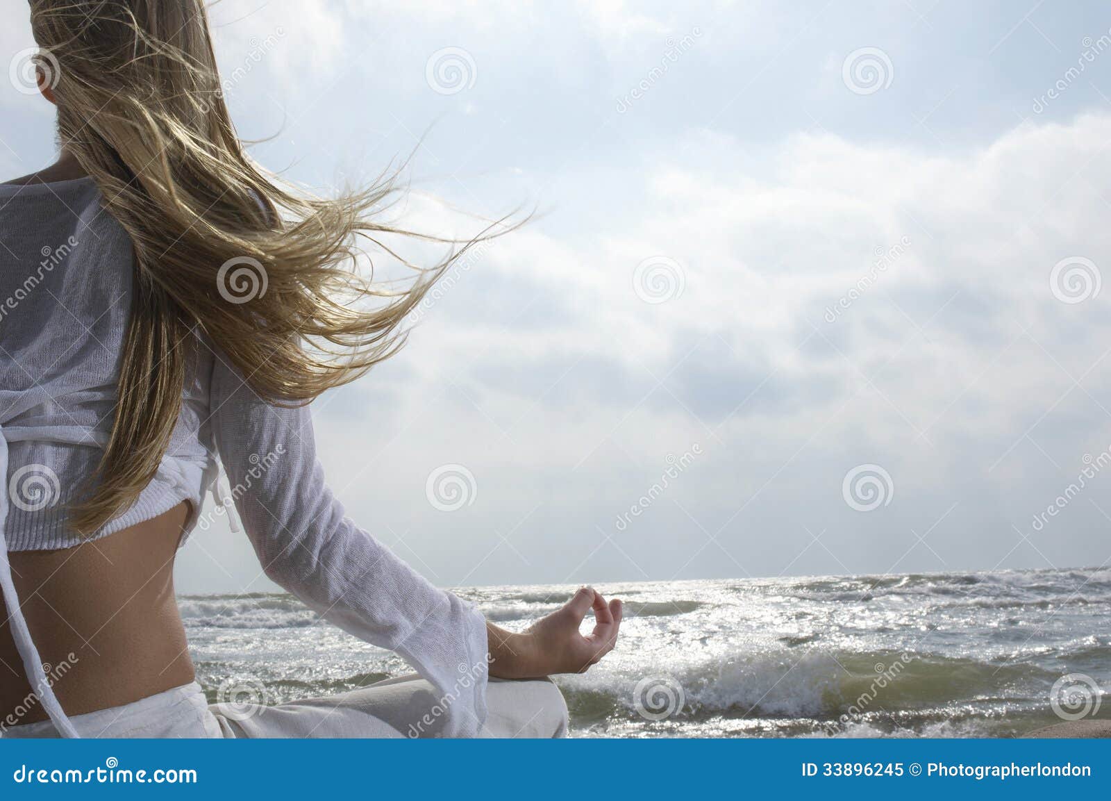 Woman Meditating by the Ocean Stock Image - Image of blonde, lotus ...