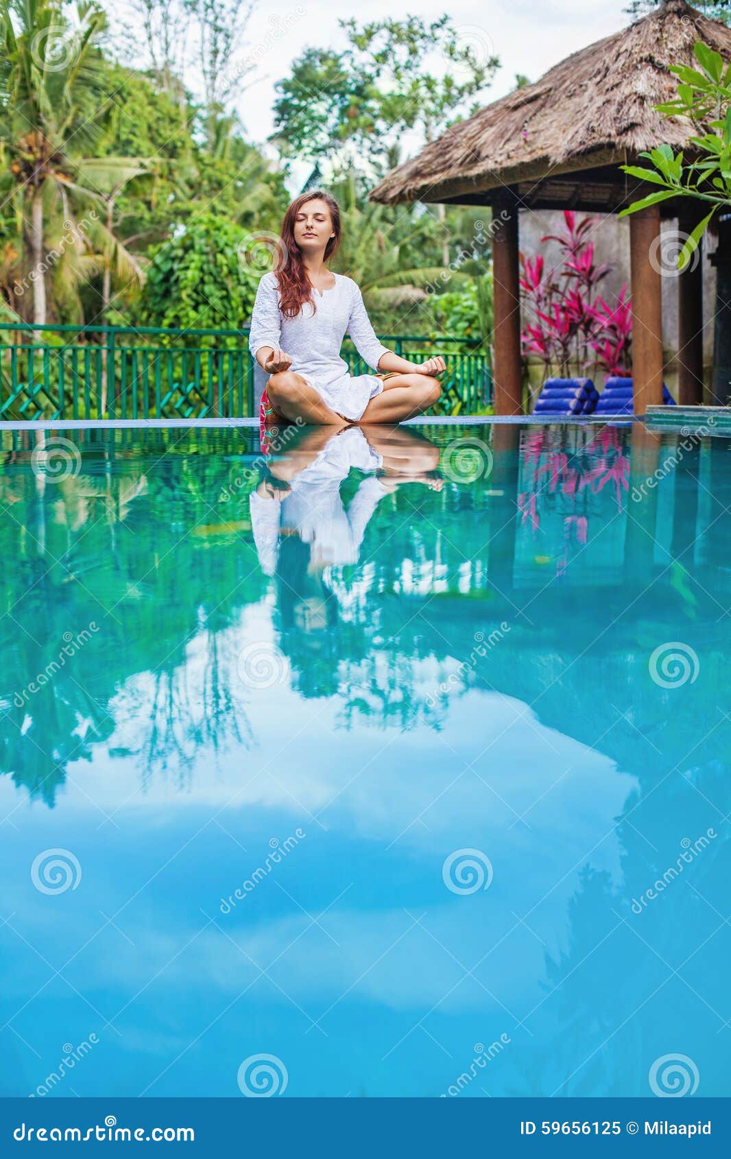 Woman Meditating at Pool Side Stock Image - Image of palms, feng: 59656125