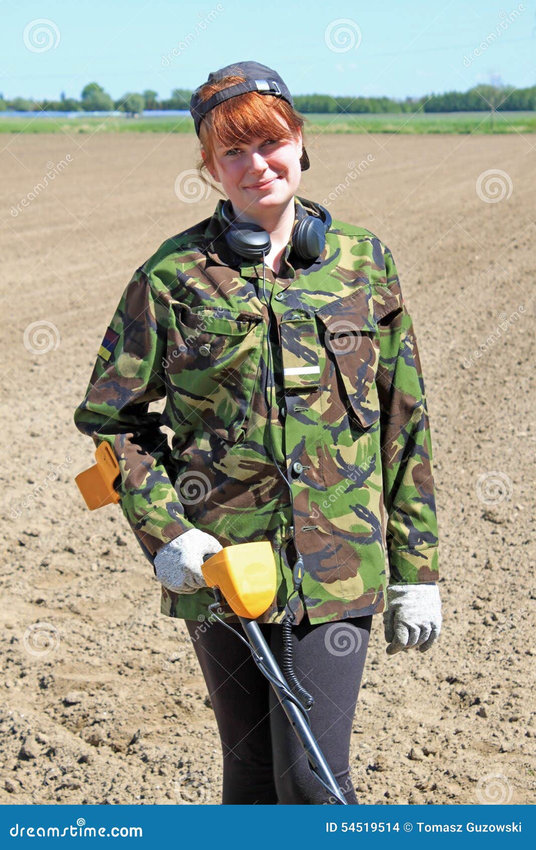 Woman with metal detector stock photo. Image of field - 54519514