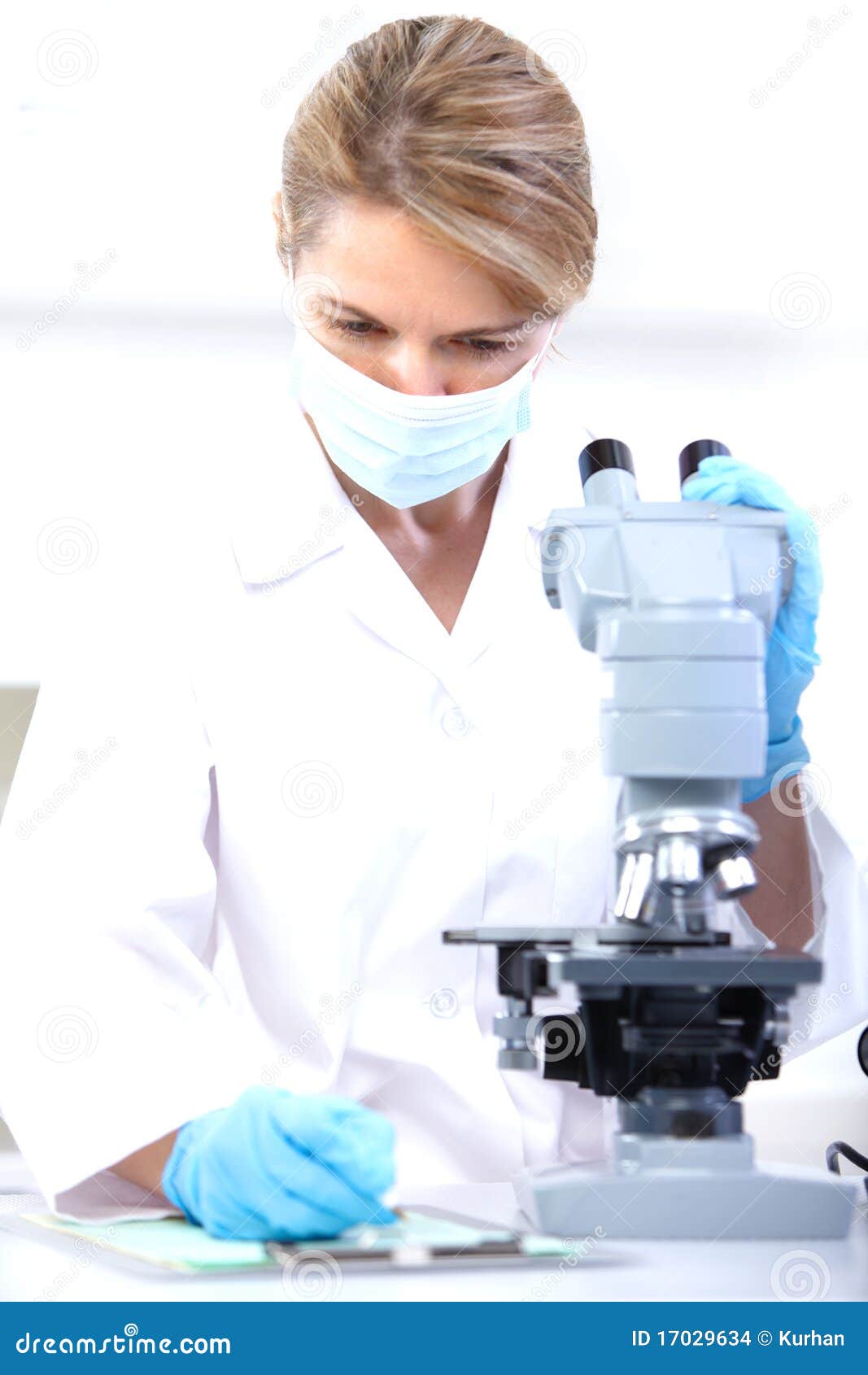 Woman with microscope stock photo. Image of female, look - 17029634