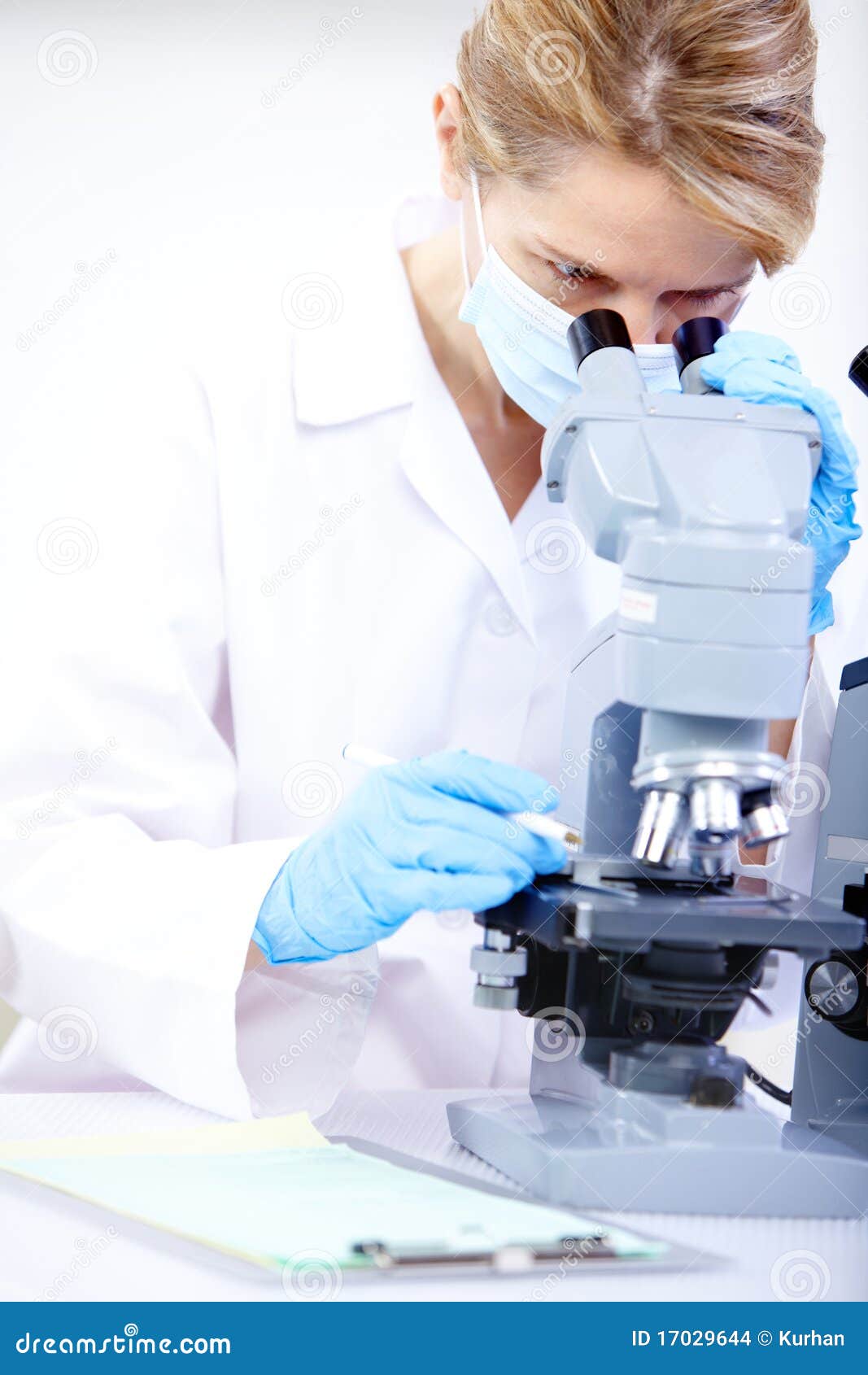 Woman with microscope stock photo. Image of laboratorian - 17029644