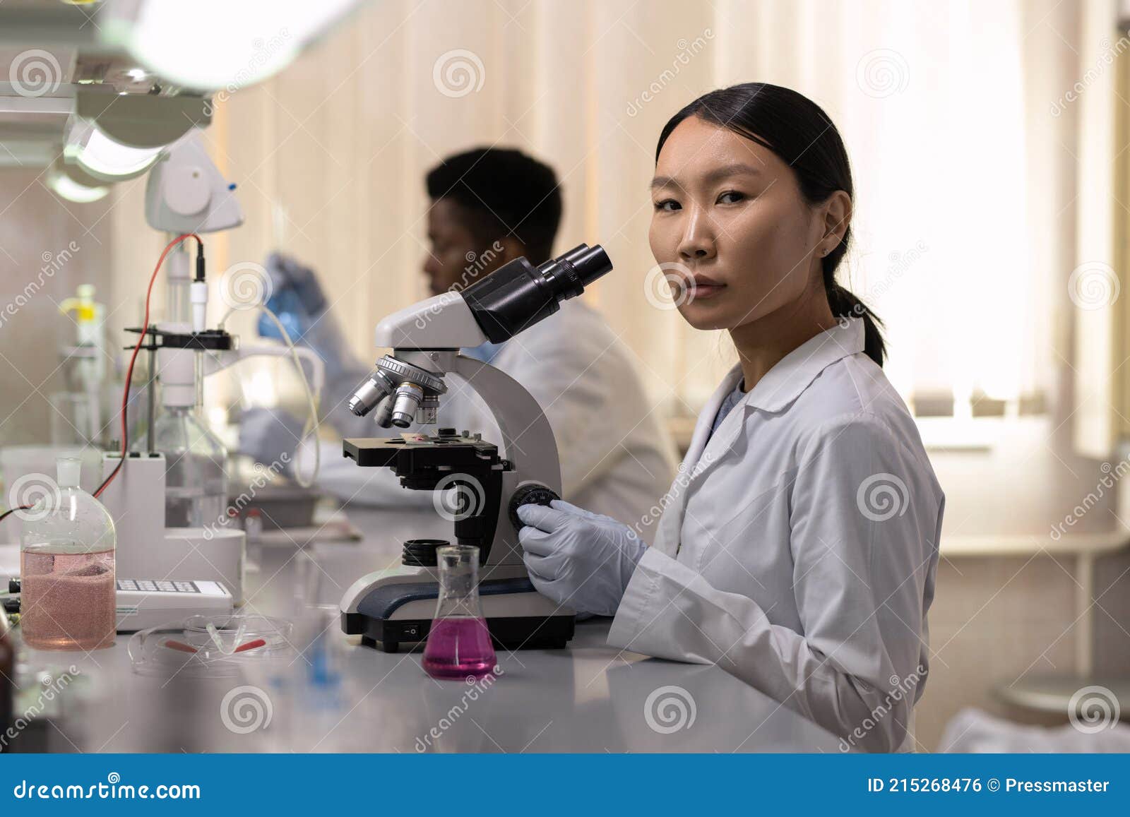 Woman with Microscope at the Lab Stock Photo - Image of standing ...