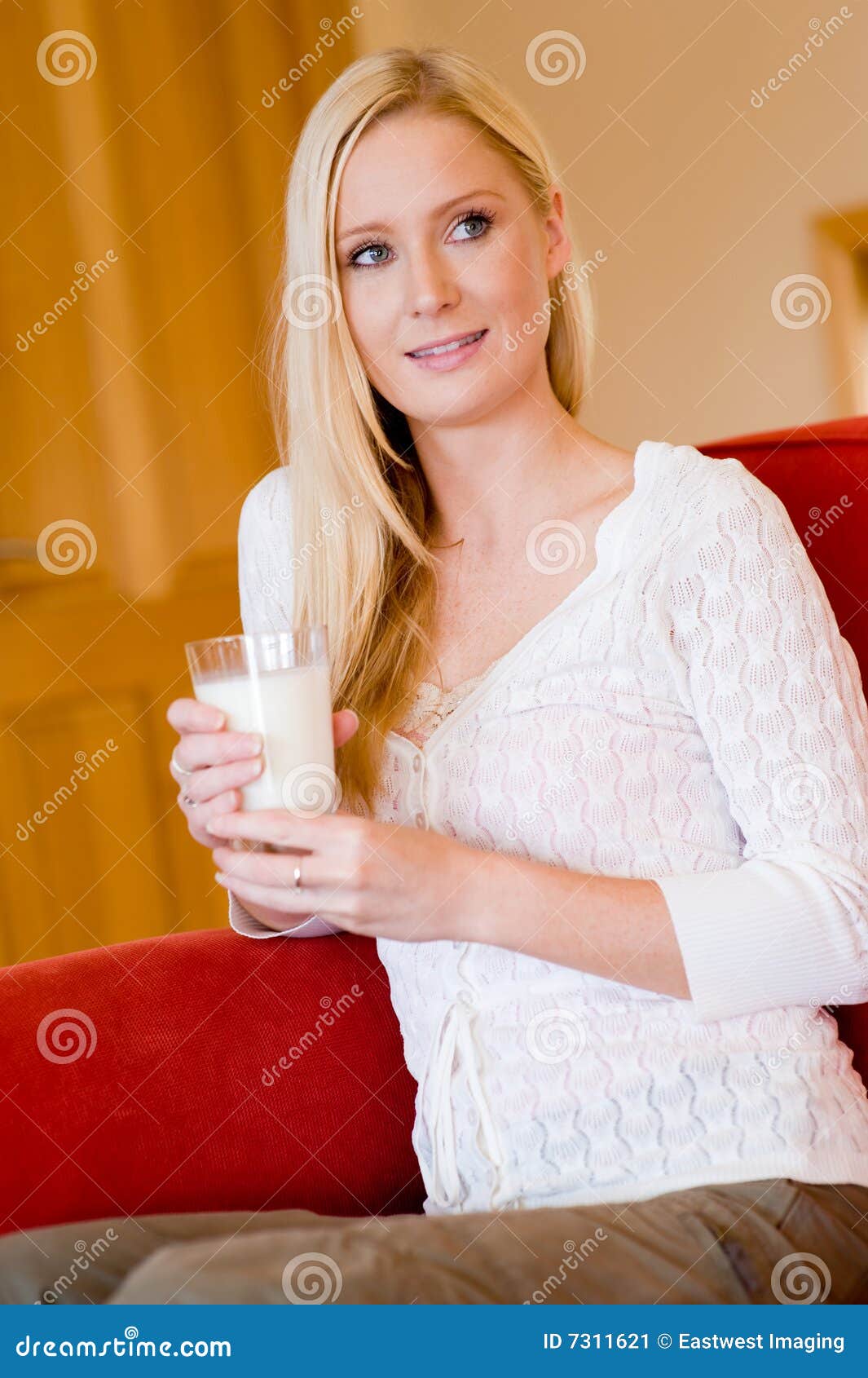 Woman with Milk stock image. Image of blond, sofa, woman - 7311621