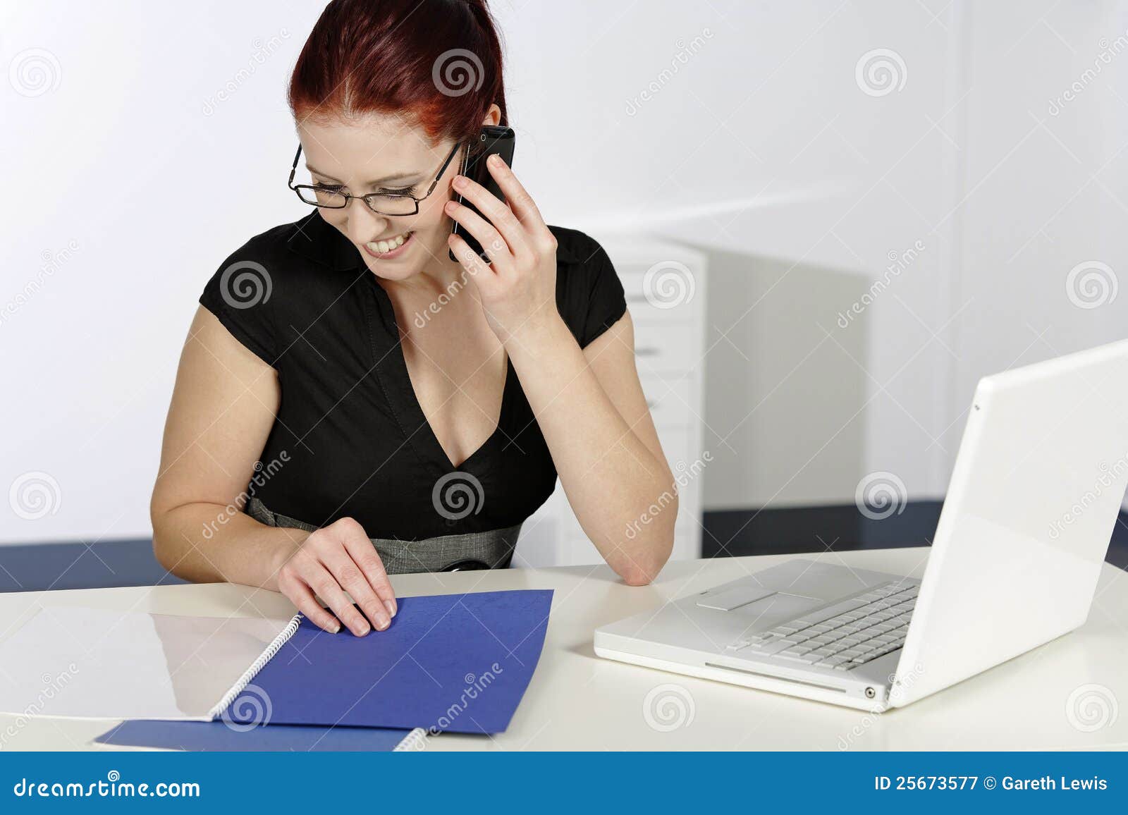 Woman on mobile at work stock image. Image of desk, professional - 25673577