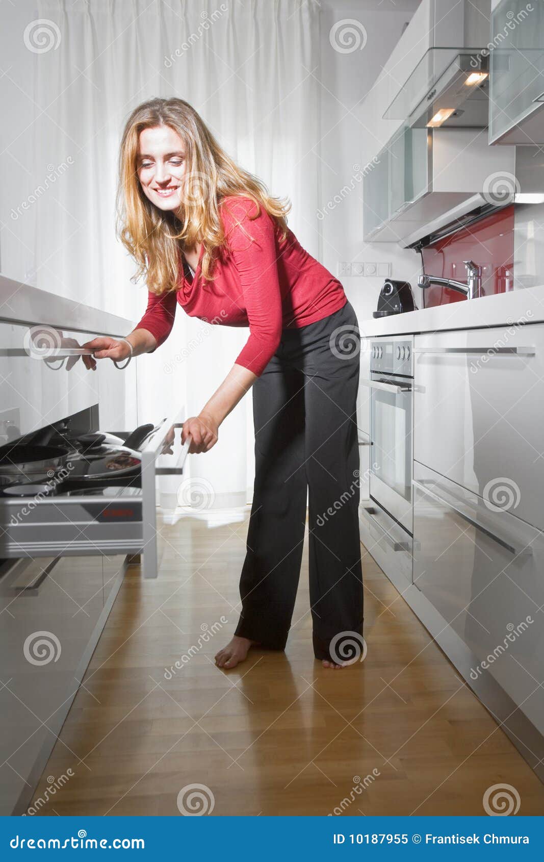 Woman in modern kitchen stock image. Image of female - 10187955