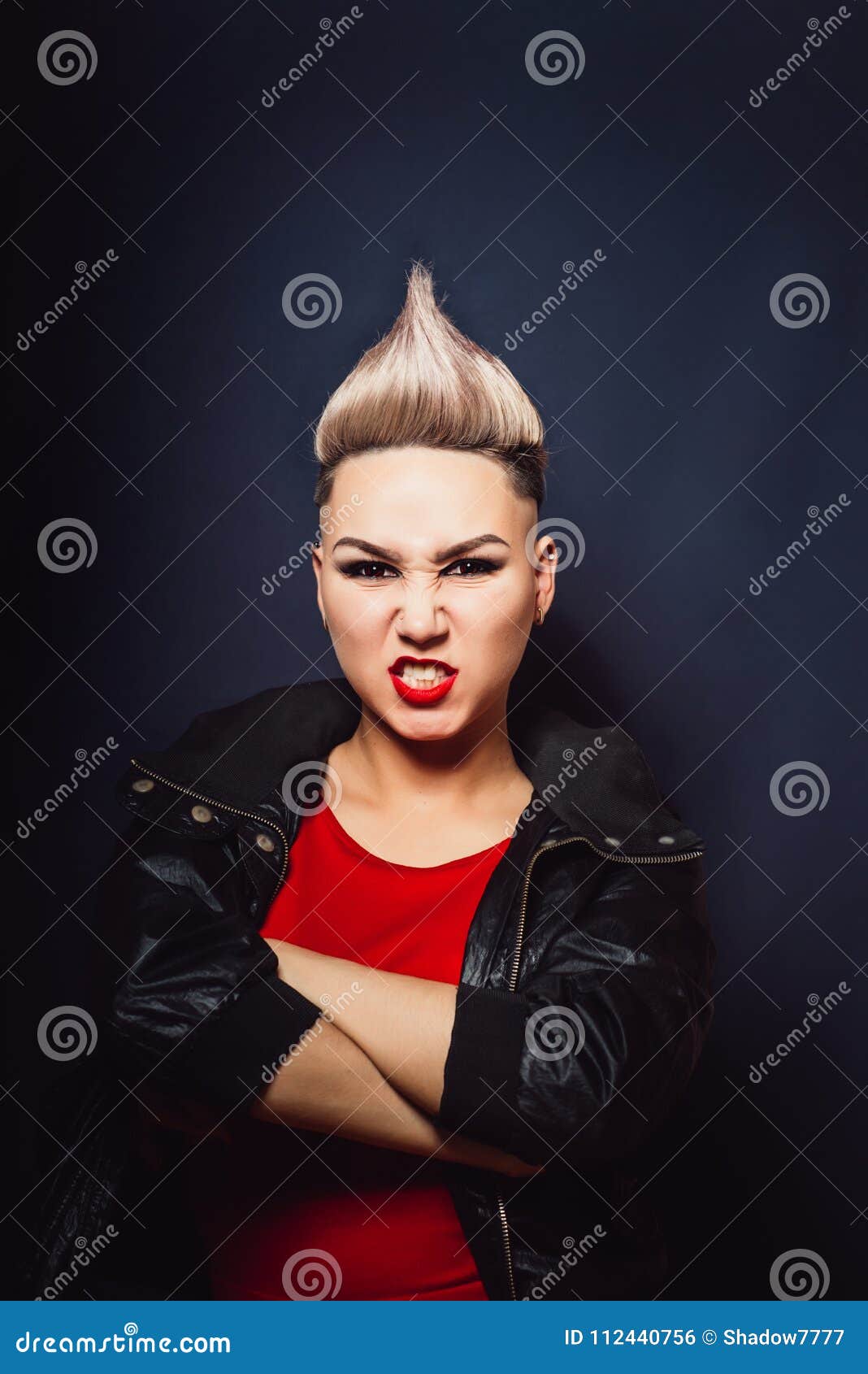 A Woman with a Mohawk Shows Her Teeth Stock Photo - Image of hairstyle ...