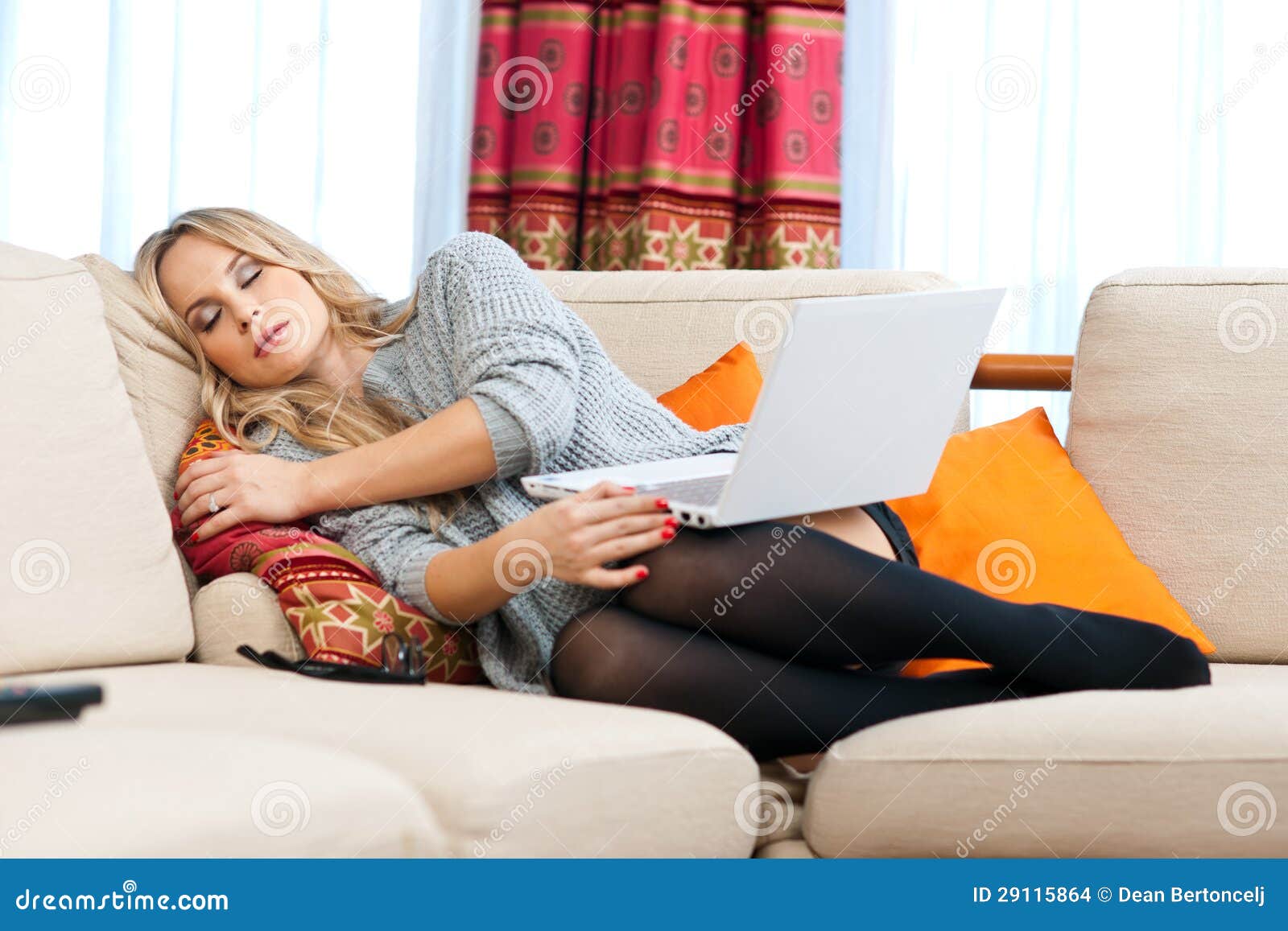 Woman napping on her sofa stock photo. Image of home - 29115864