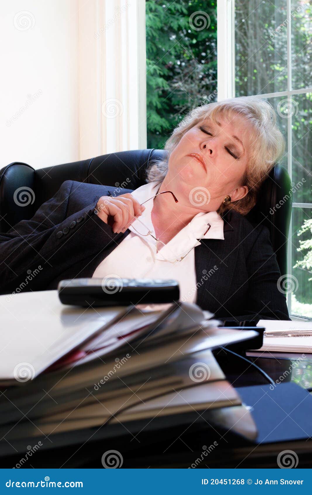 Woman naps at her desk stock photo. Image of lady, midlife - 20451268