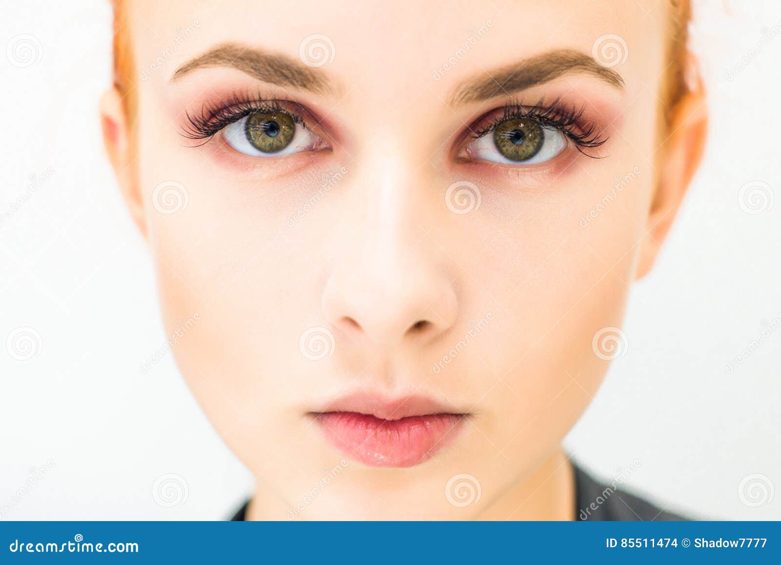 Woman with Natural Make-up on a Light Background Smiling Stock Photo ...