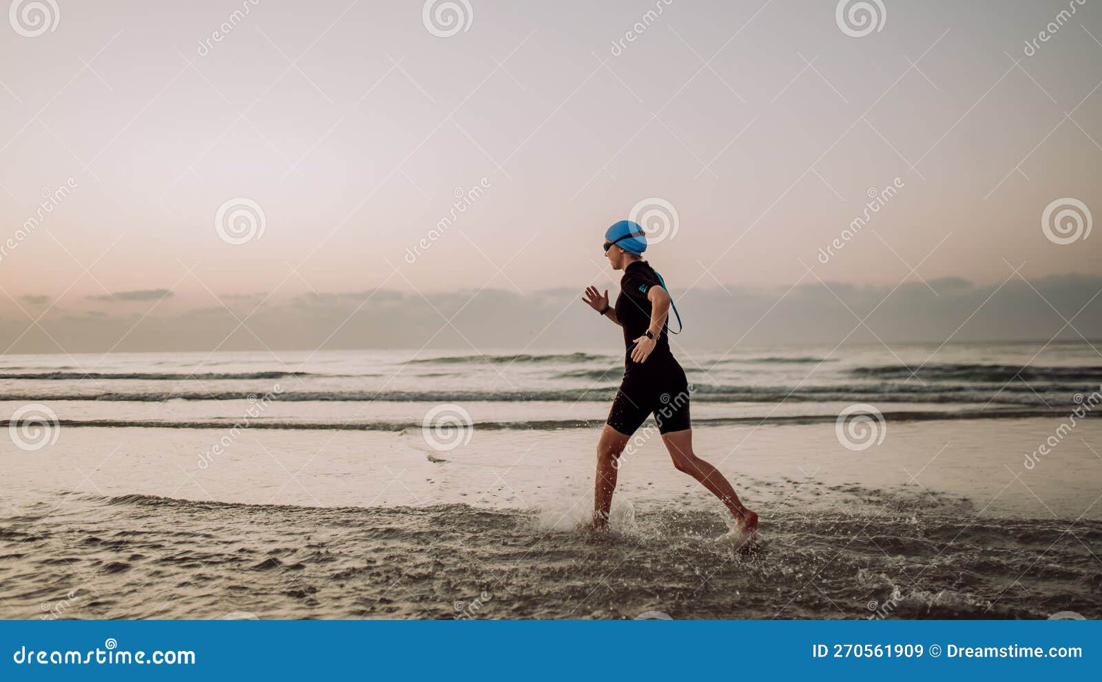 Woman in Neoprene Running Along of the Ocean. Stock Image - Image of ...