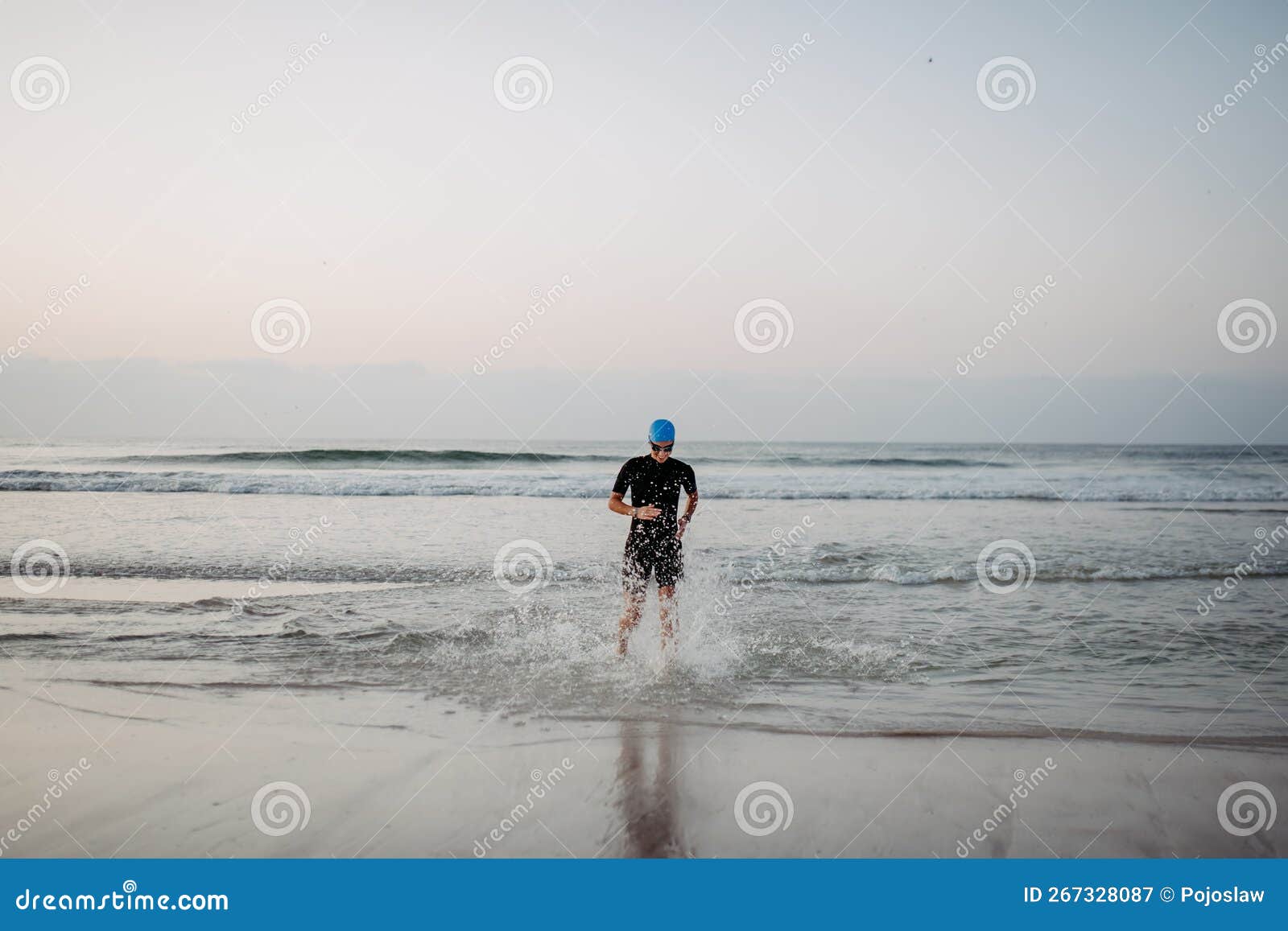 Woman in Neoprene Running Out of the Ocean. Stock Image - Image of ...