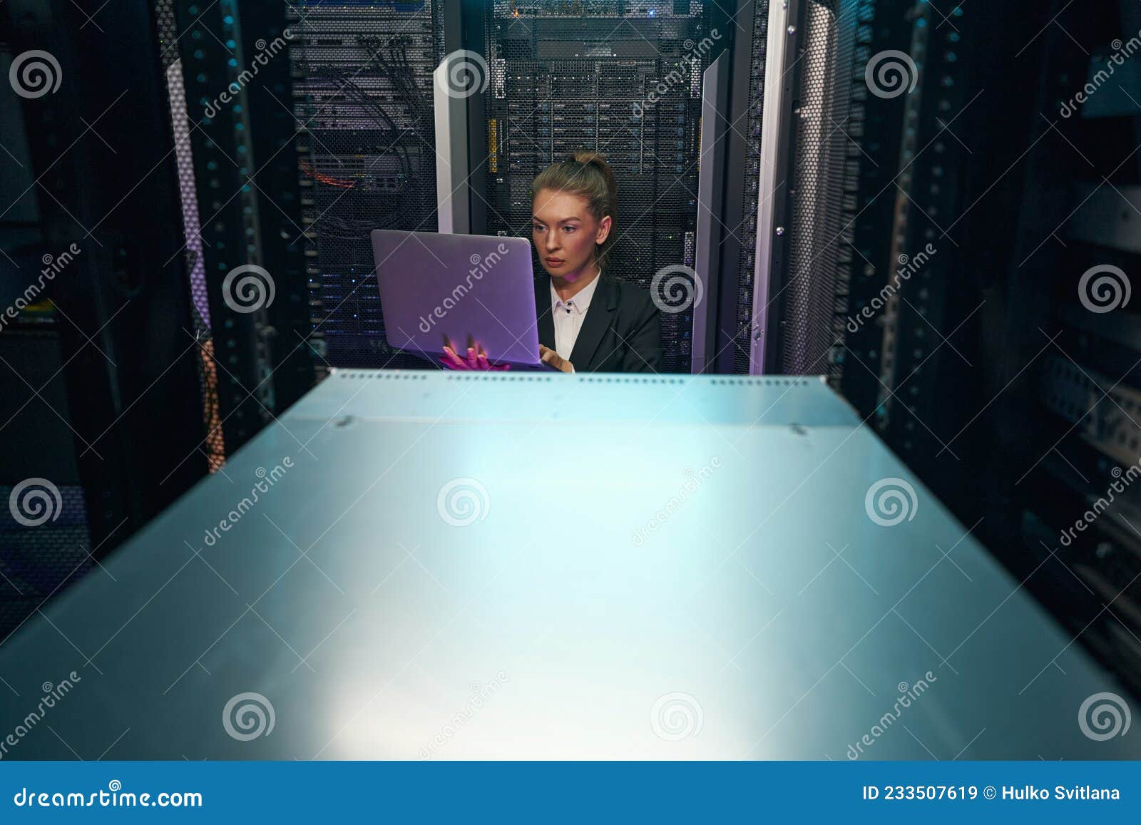 Woman Network Engineer Using Laptop while Working in Server Room Stock ...