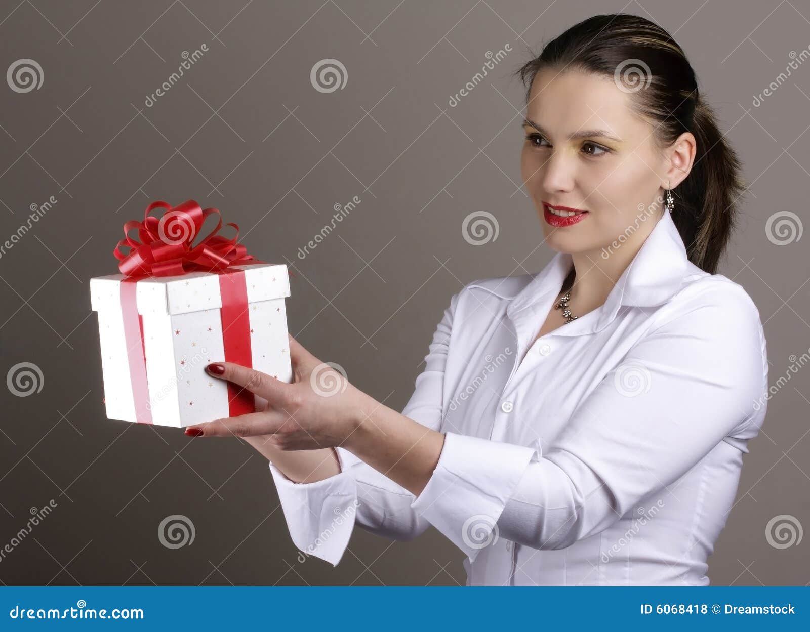 Woman offering a gift stock photo. Image of surprise, lifestyle - 6068418
