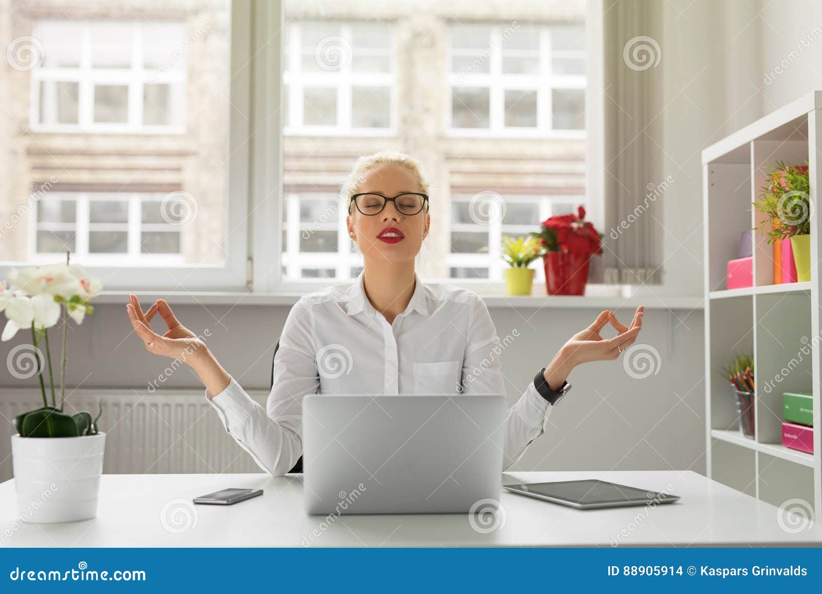 Woman in office meditating stock photo. Image of desk - 88905914