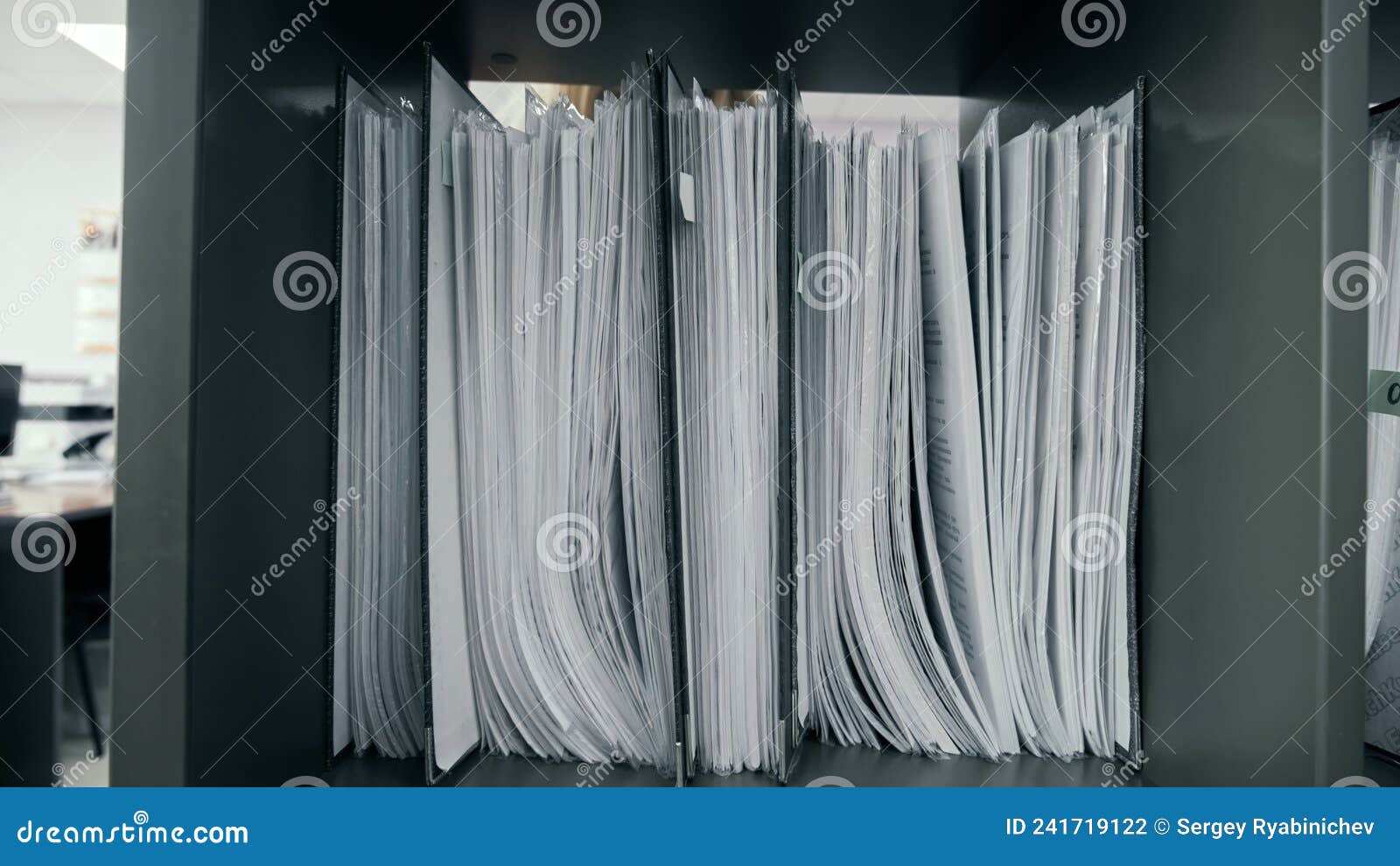 Woman in the Office Takes a Folder with Documents from the Document ...