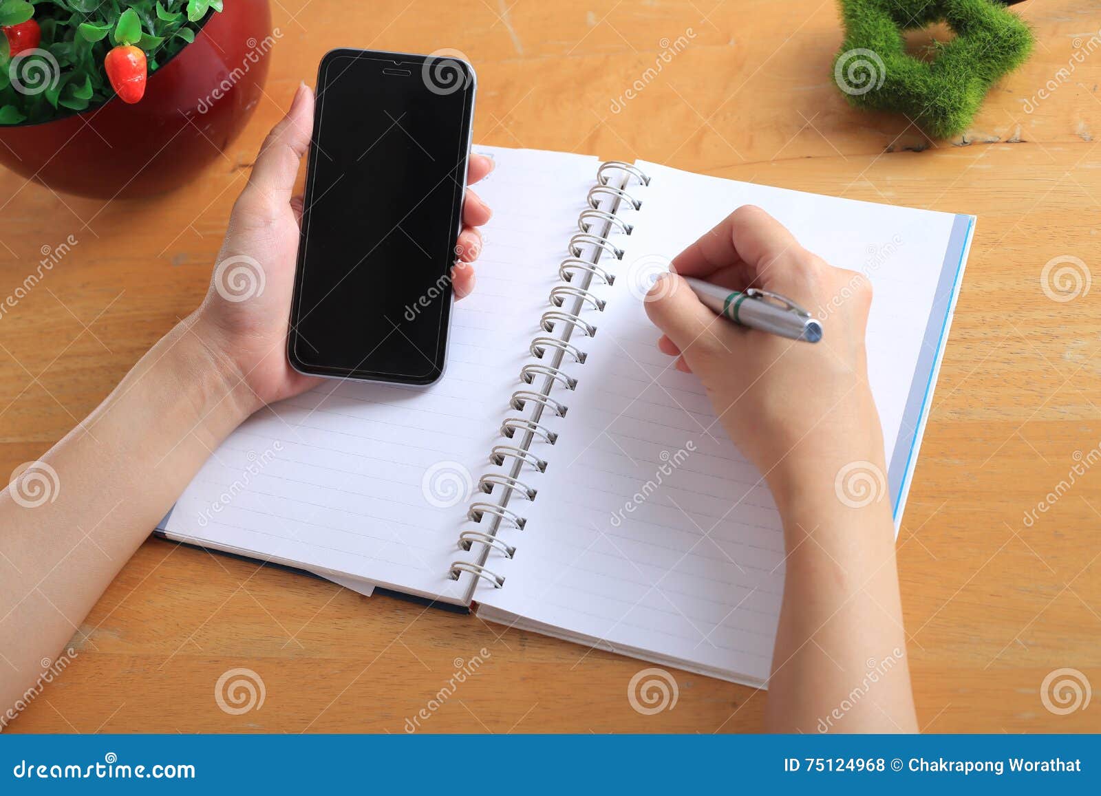 Woman Office Write Notes and Use Smart Phone on Wooden Table. Stock ...