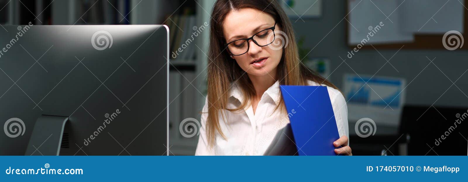 Opened Red Folder Held By Redheaded Young Professional Woman Pointing ...